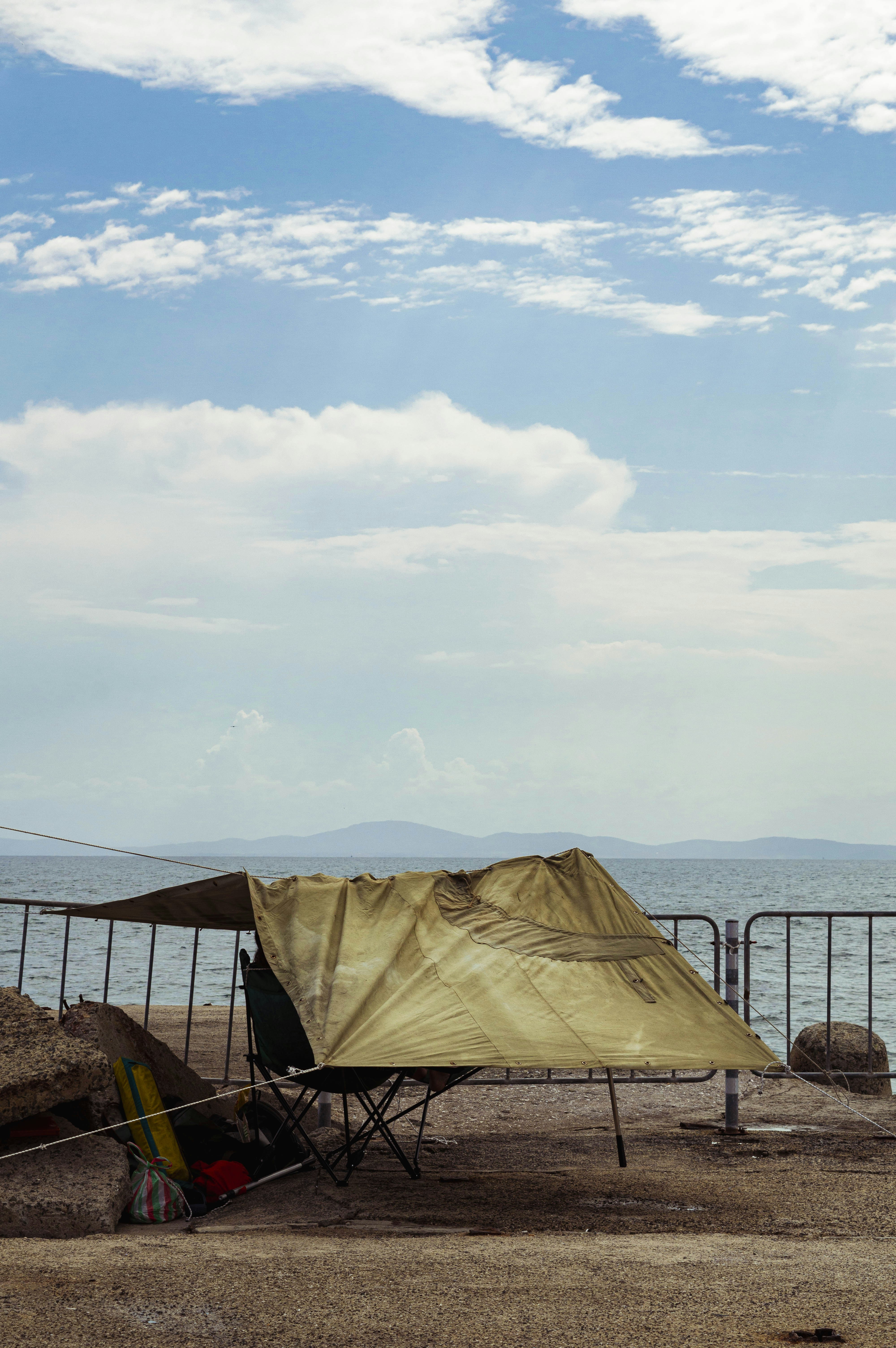 Shaded Coastline Camp Under Open Sky