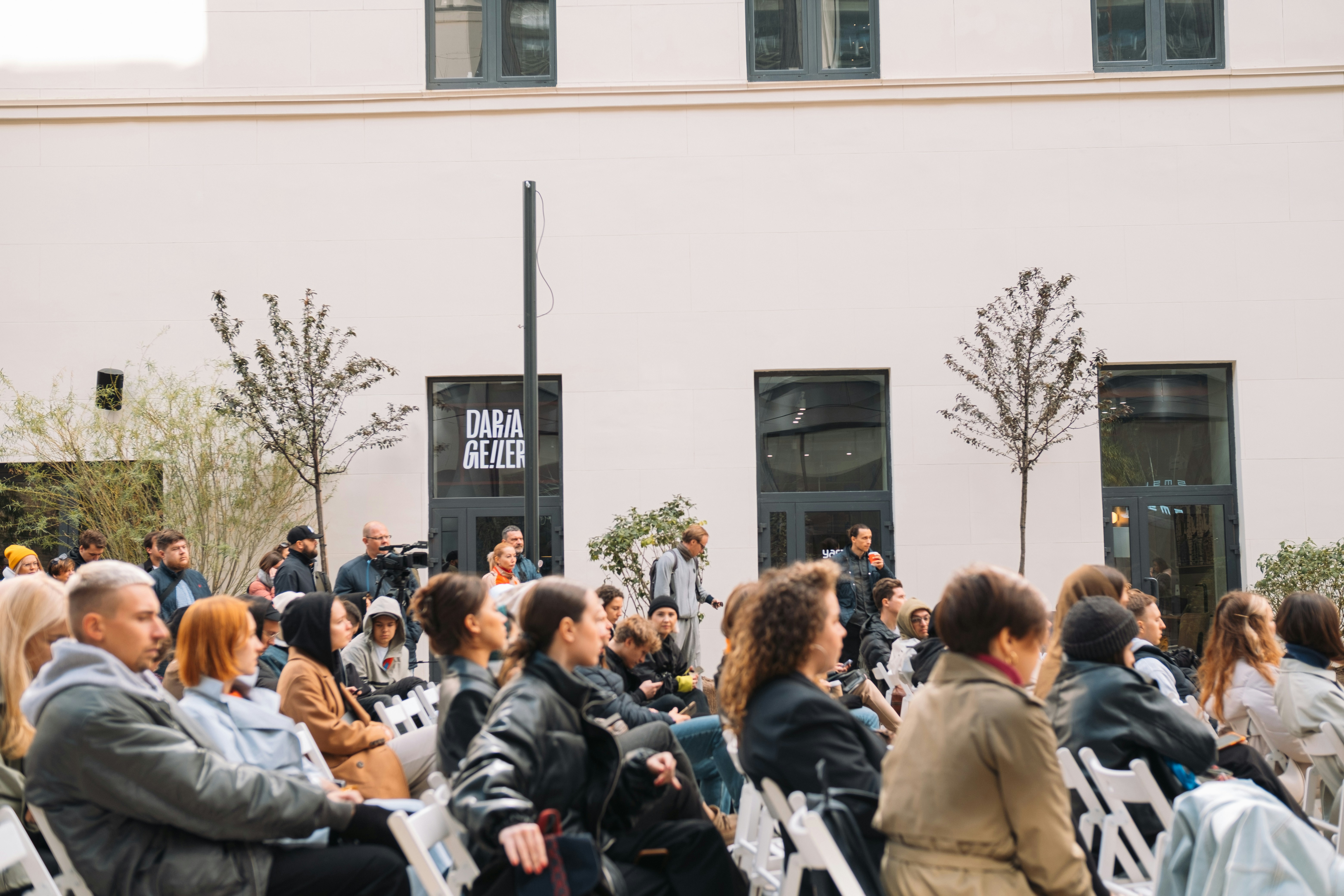 A group of people outside a building photo – Free Human Image on Unsplash