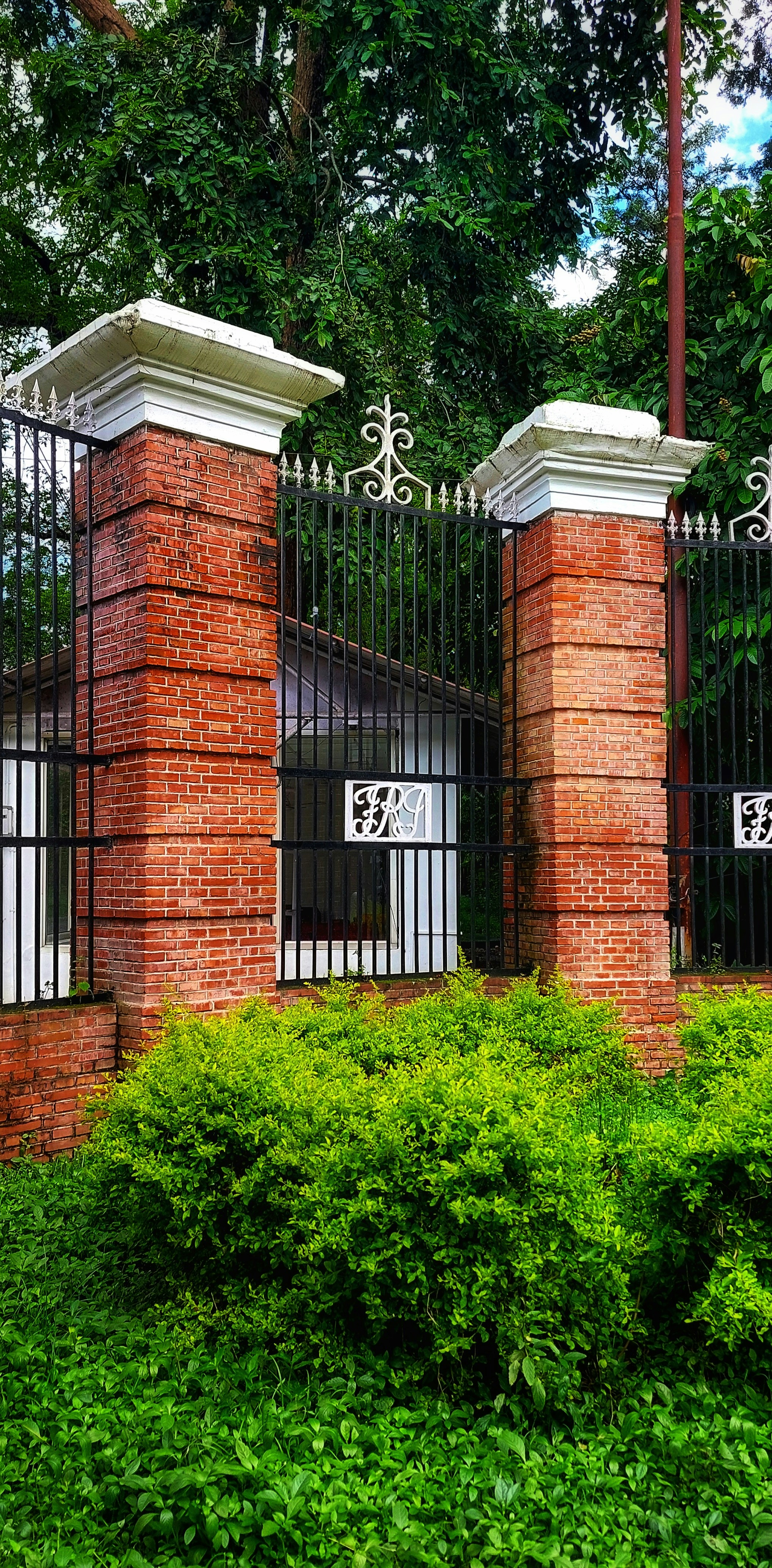 A gated entrance to a building photo – Free Forest research institute ...