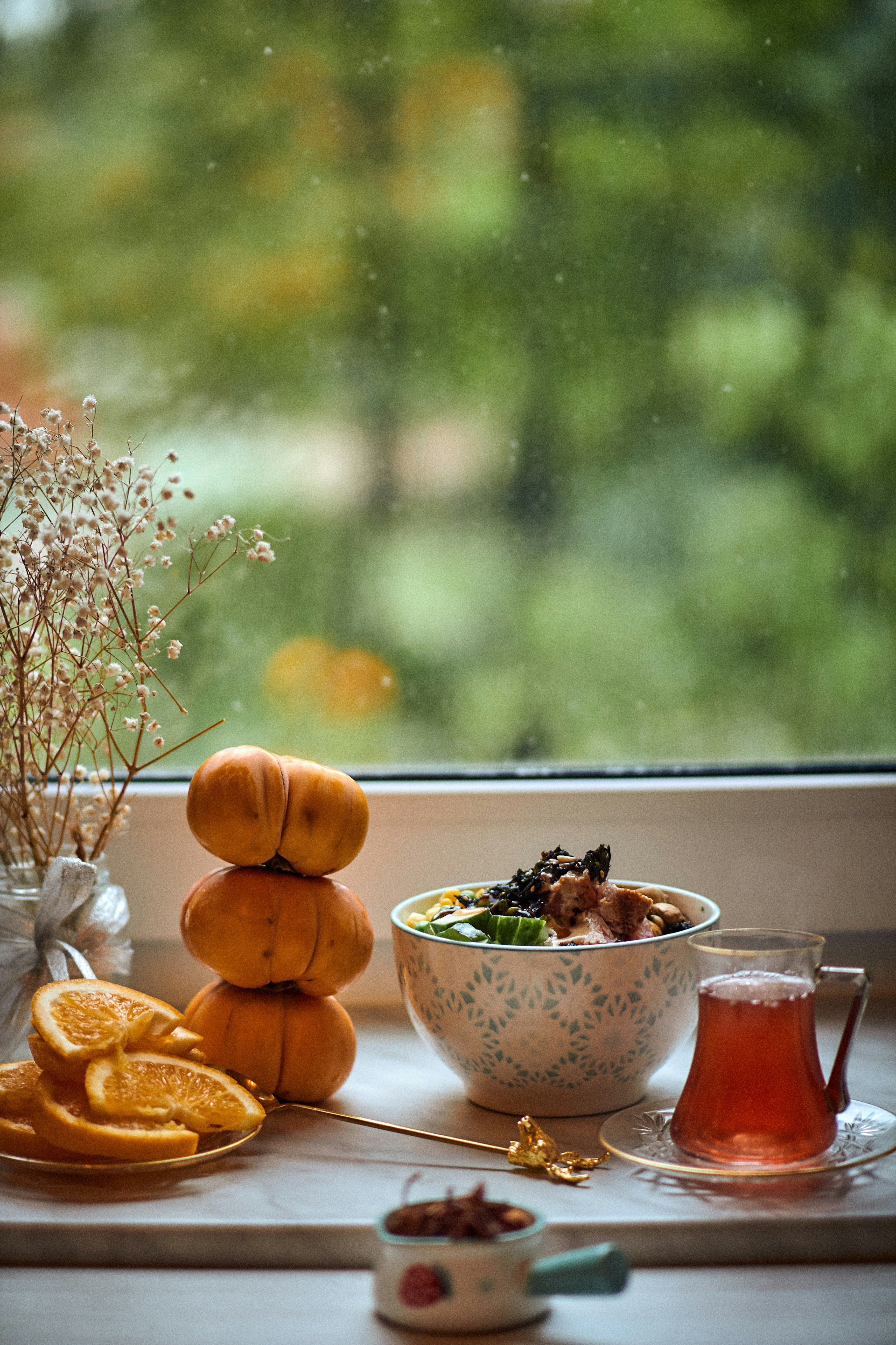 Three Tiny Pumpkins Form a Humble Still Life by the Window