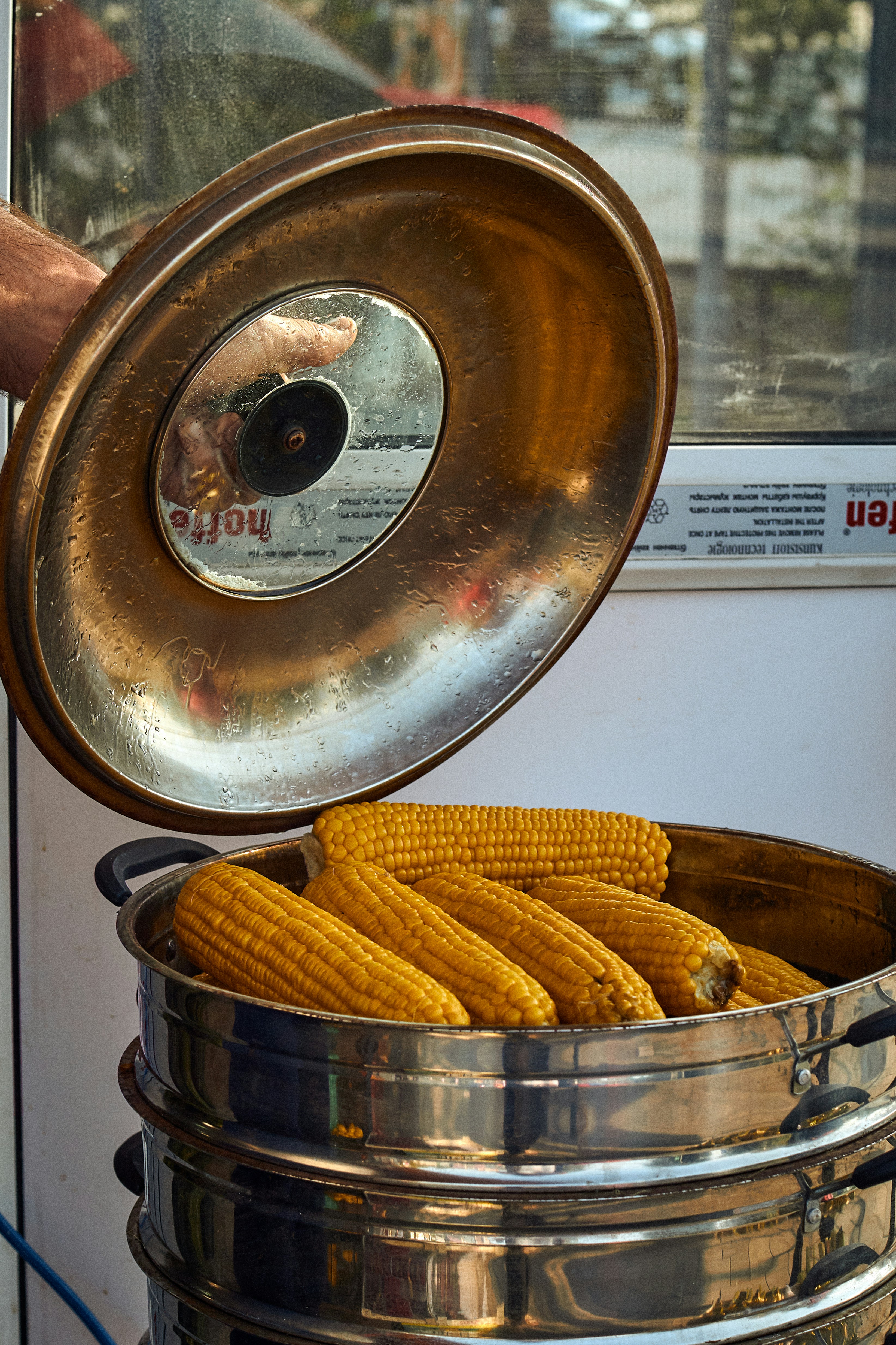 Golden Corn in a Shiny Steam Basket: a Quiet Kitchen Moment
