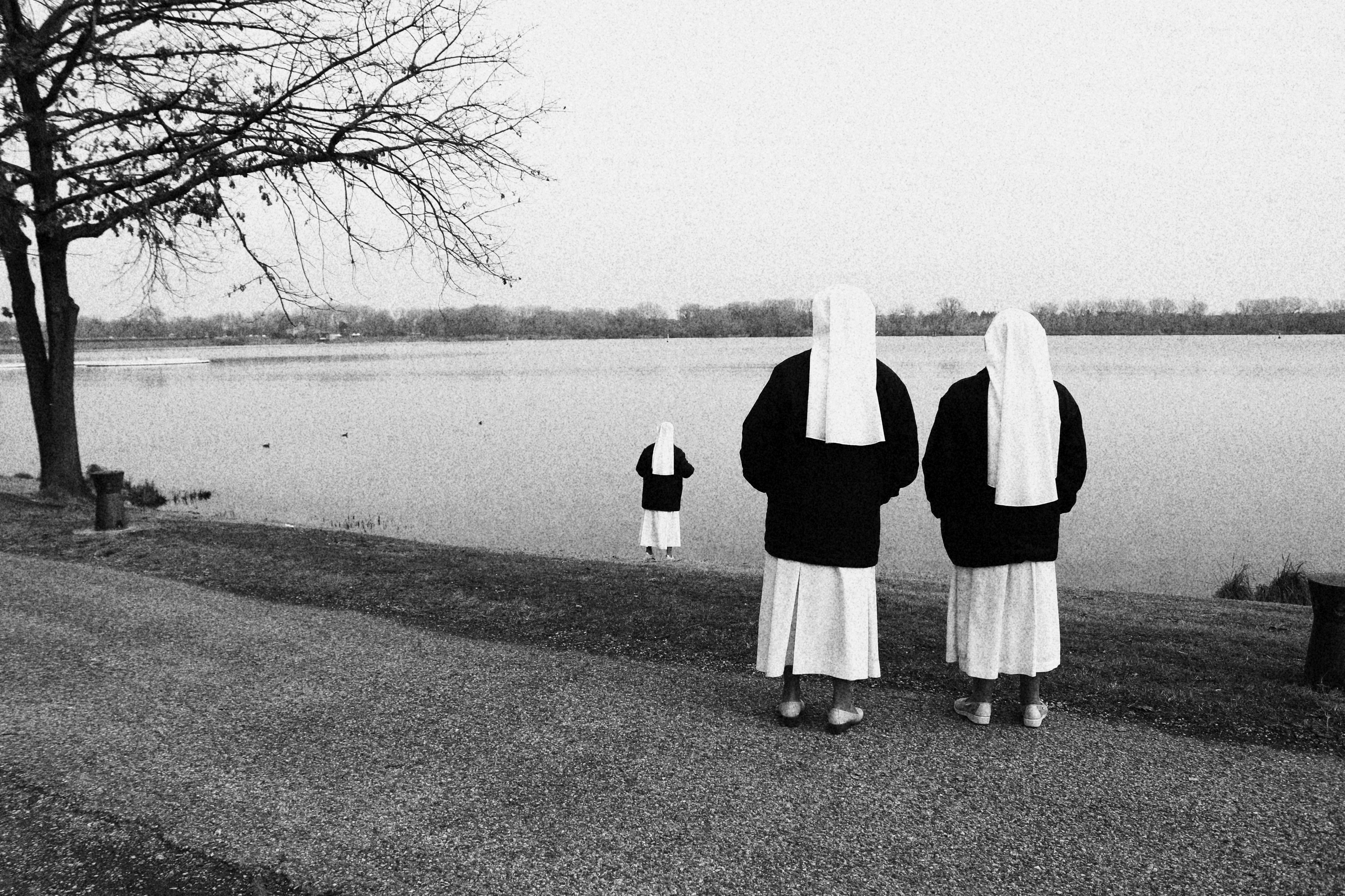 two women walking down a path