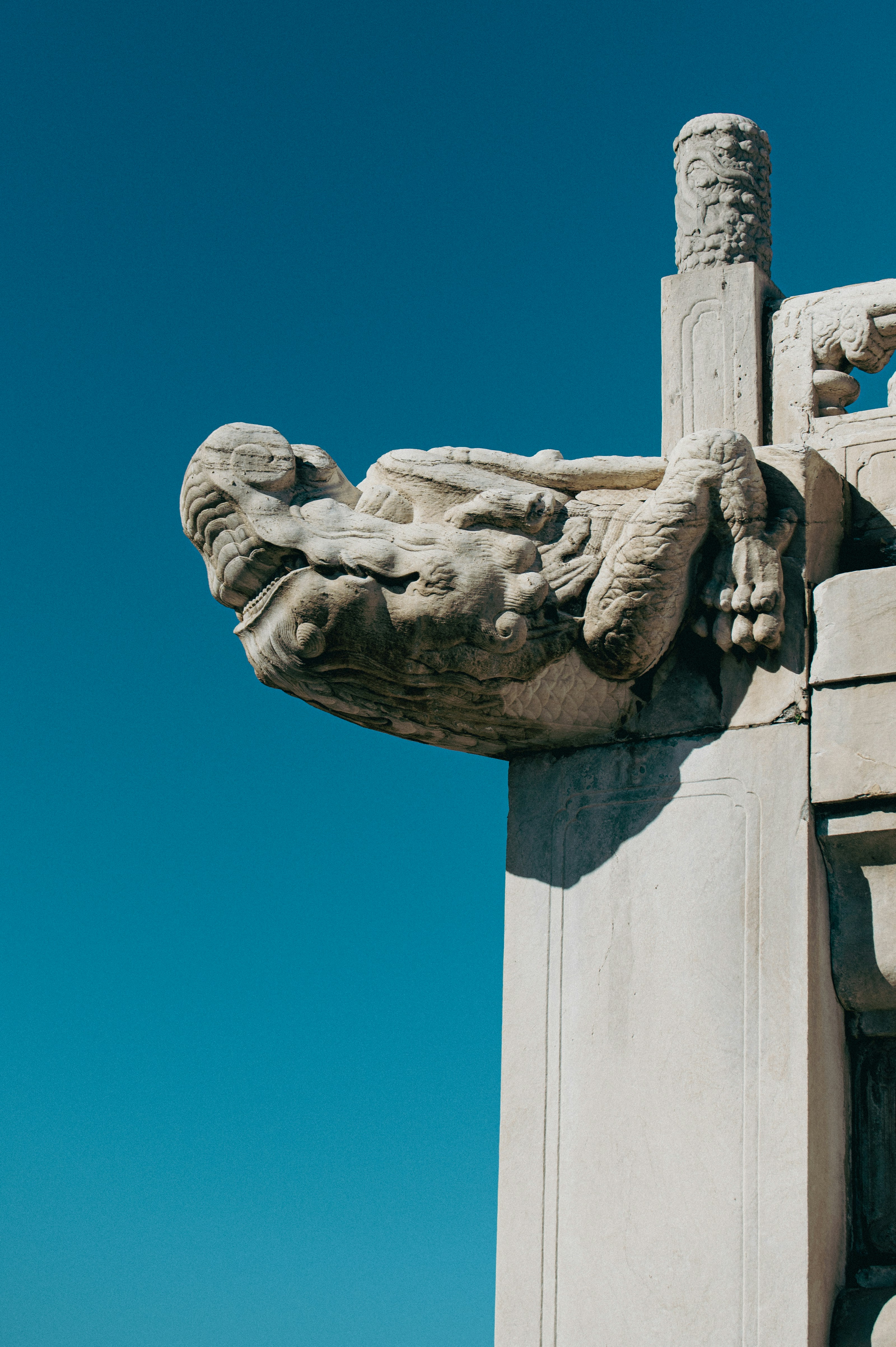 A stone statue of a person with a beard and mustache photo – Free The ...
