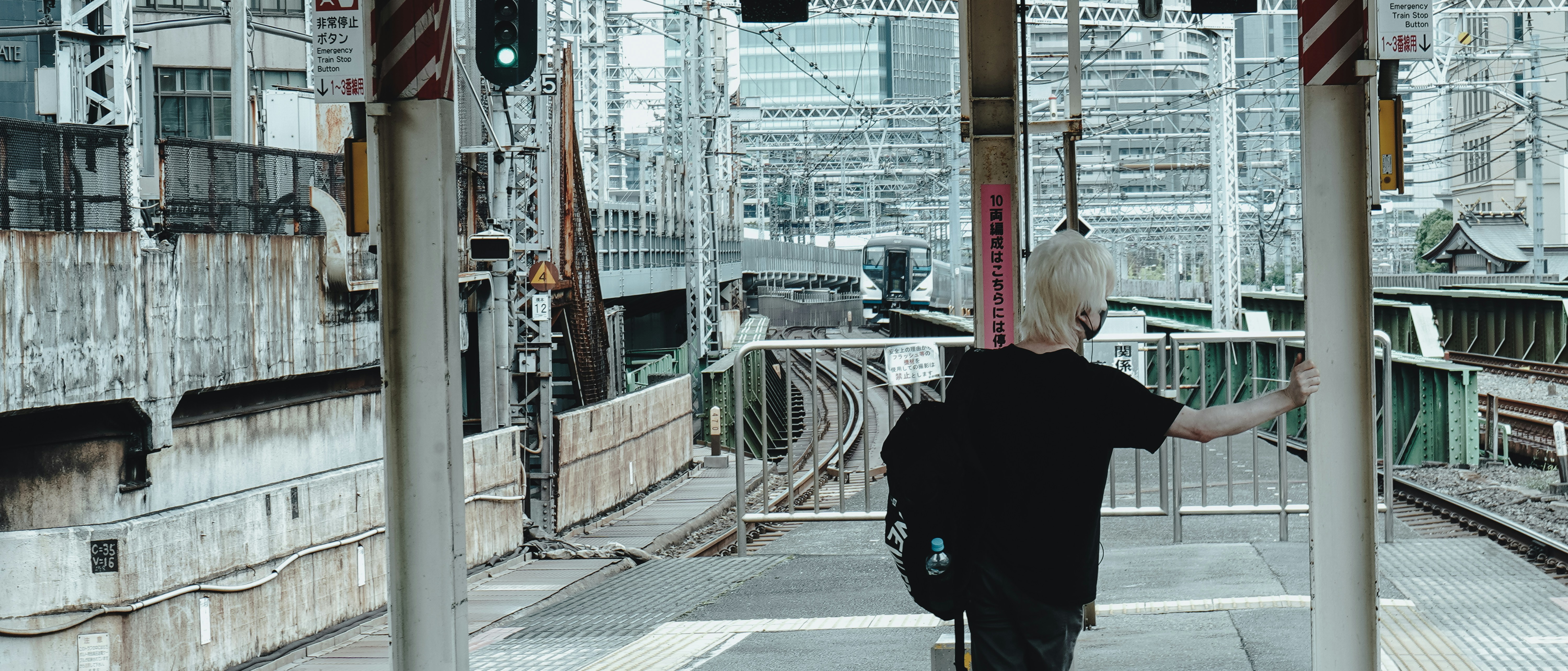 Between Rails and City Light: A Silent Exit on the Platform