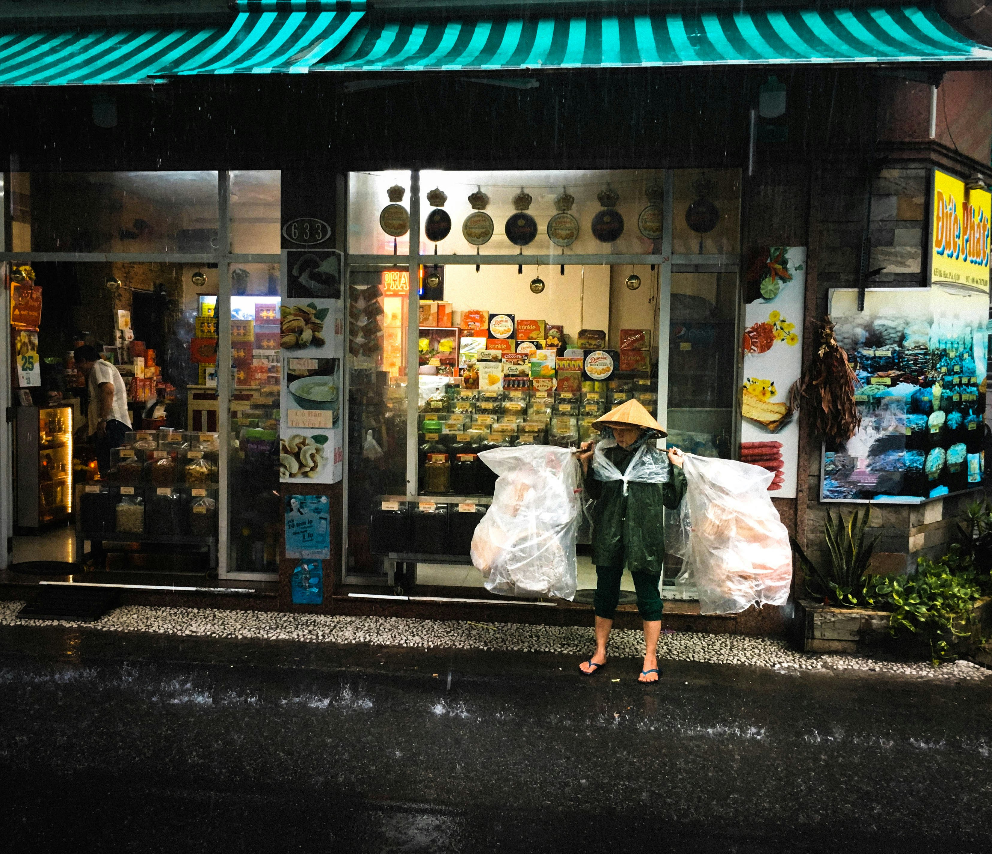 A person carrying bags on the street photo – Free Ho chi minh Image on ...