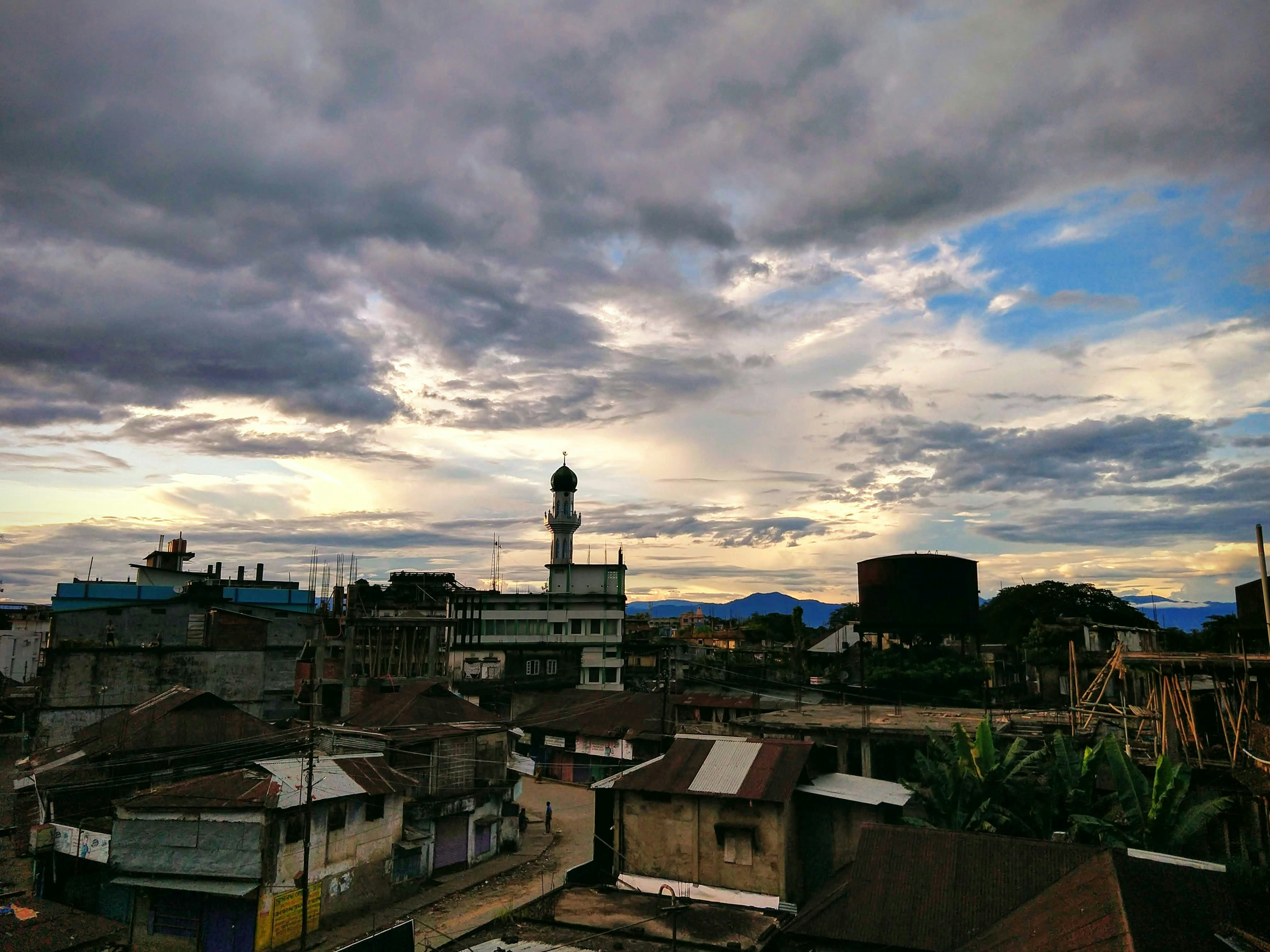 A city with a tower photo – Free Silchar Image on Unsplash