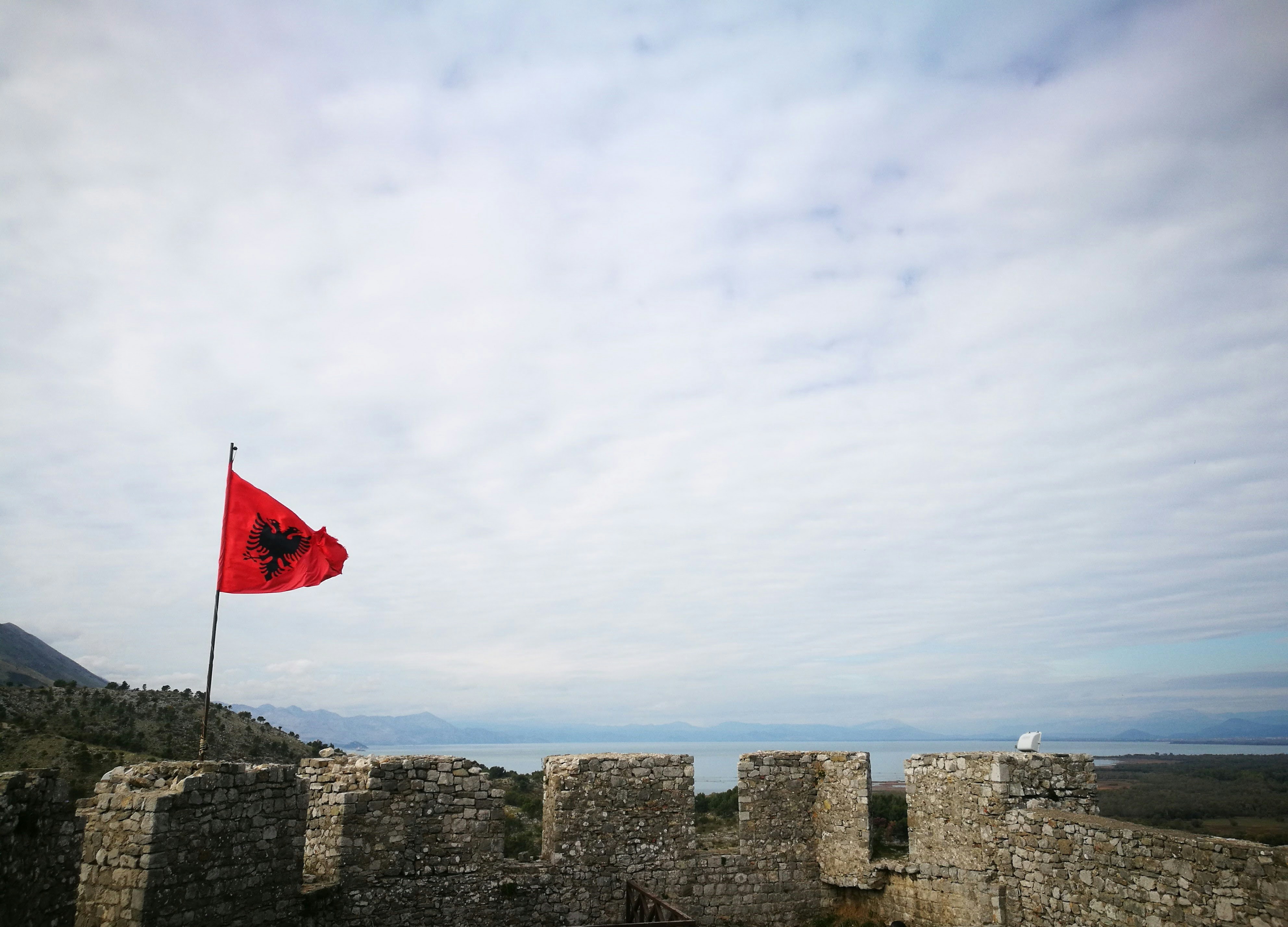 A flag on a stone wall photo – Free Albania Image on Unsplash