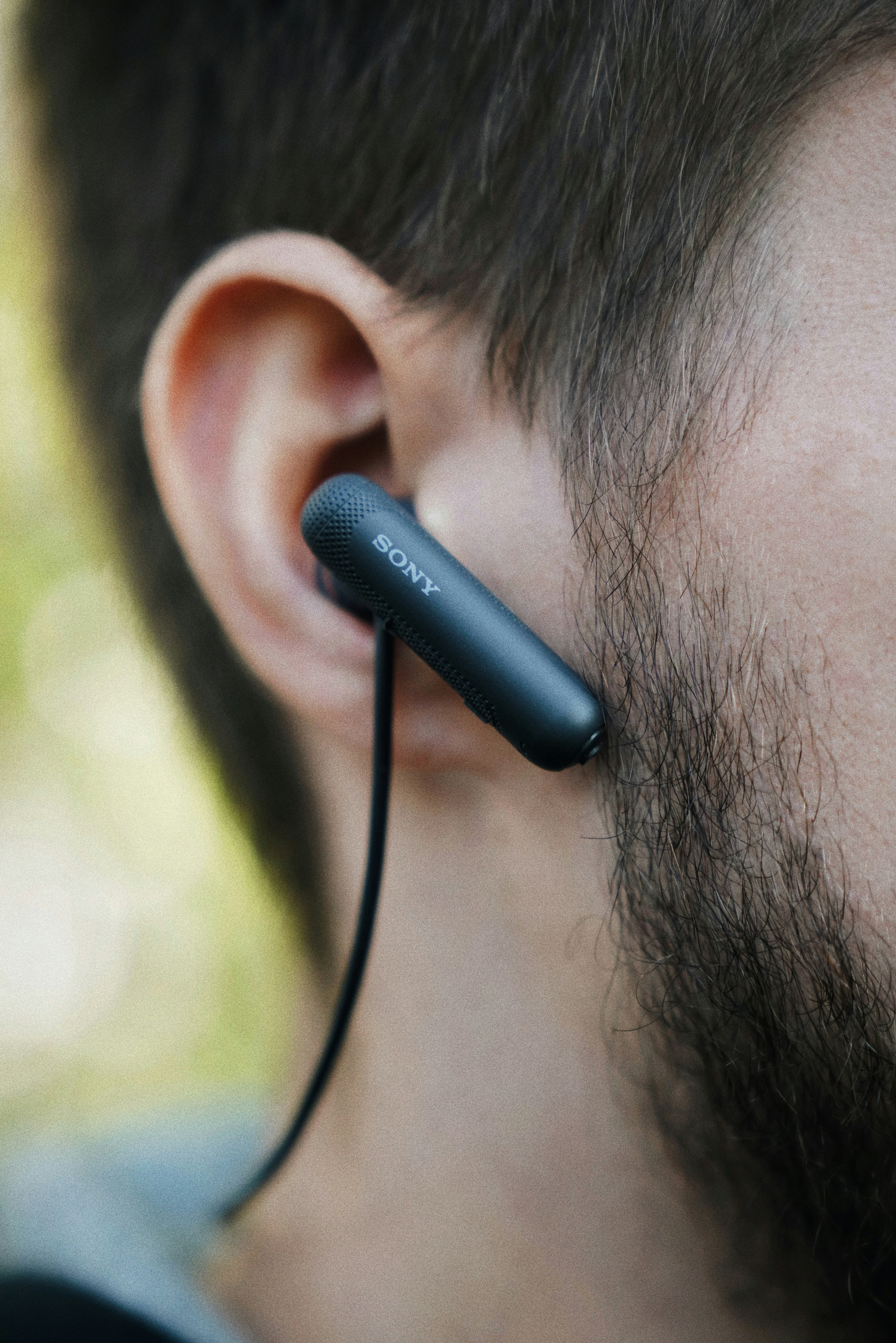 A person with a black earpiece photo – Free Microphone Image on Unsplash