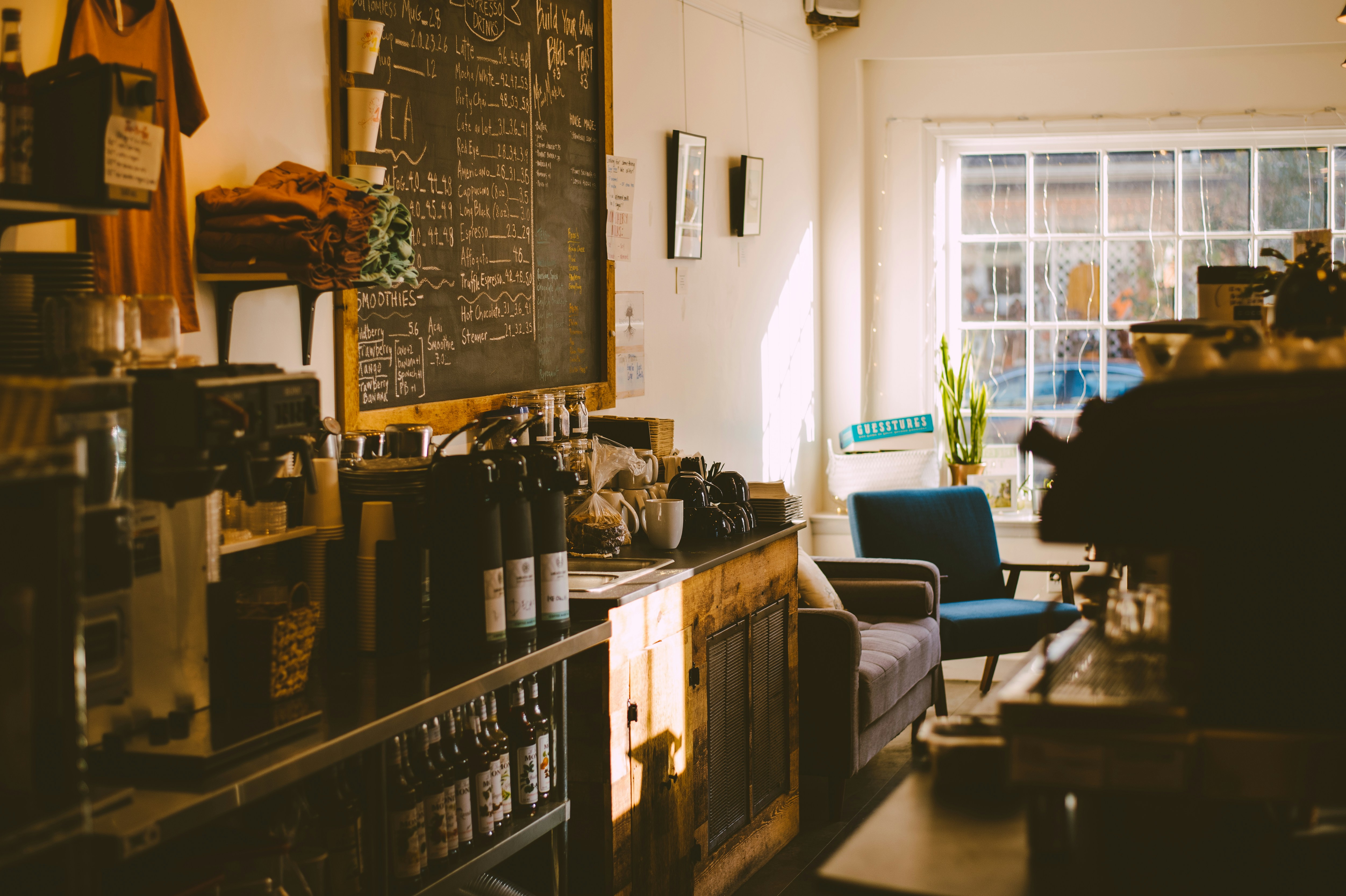A room with shelves and a chair photo – Free Coffee shop Image on Unsplash