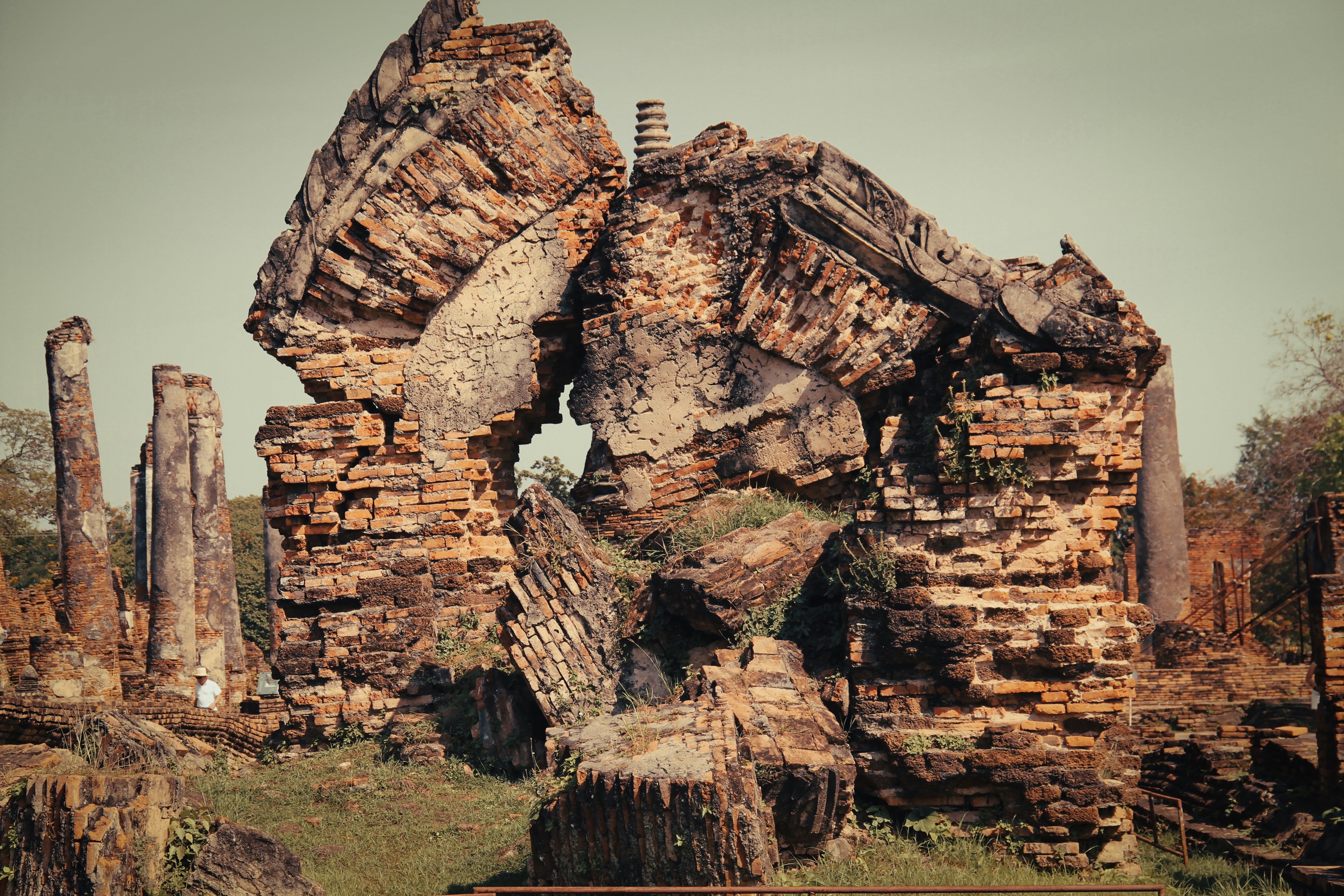Arch of Echoes: Sunlit Ruins Framed by Weathered Brick