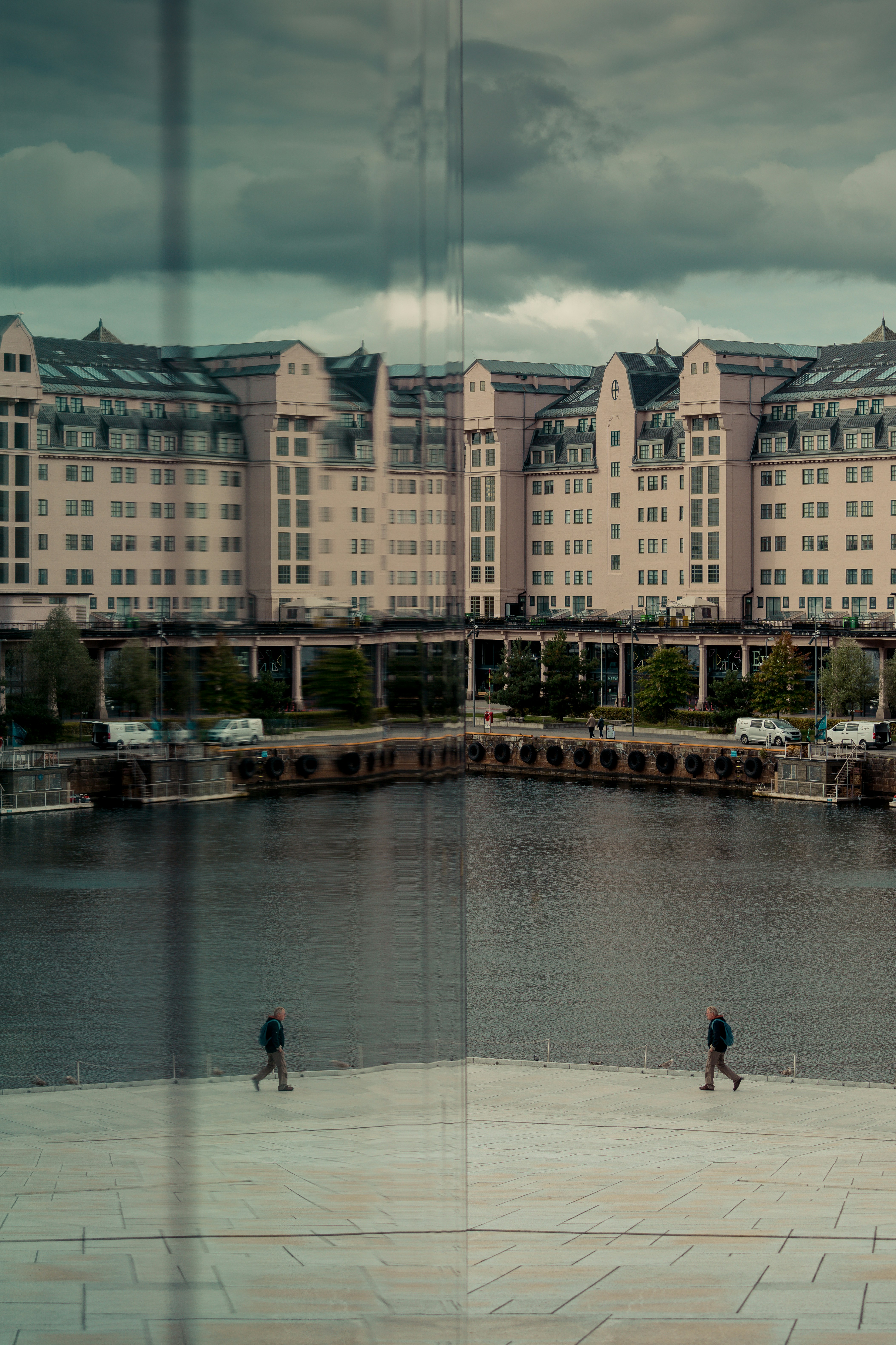 Reflection Divider: City Waterfront Framed by Glass and Walkway