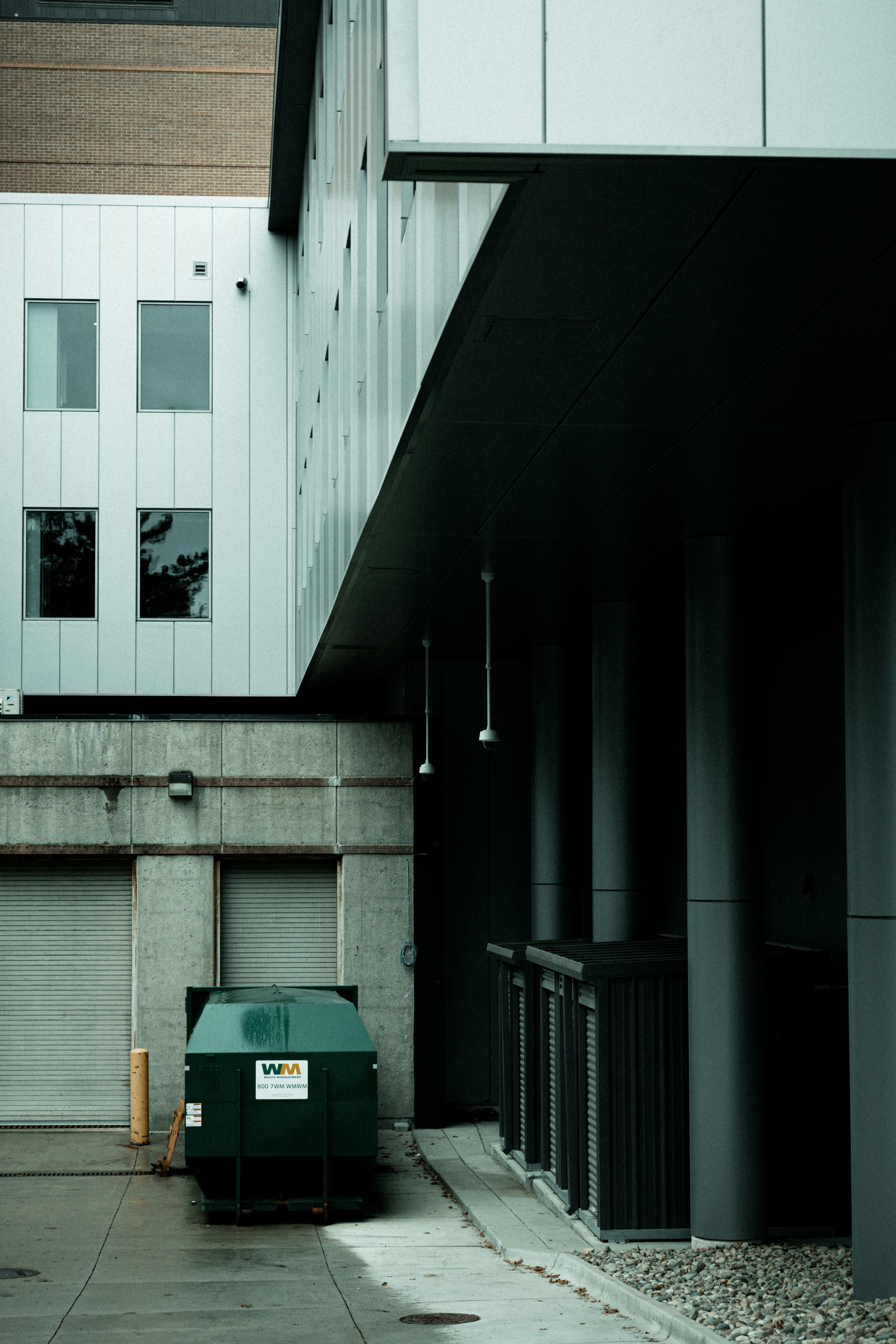 A building with a trash can in front of it photo – Free Flint Image on ...