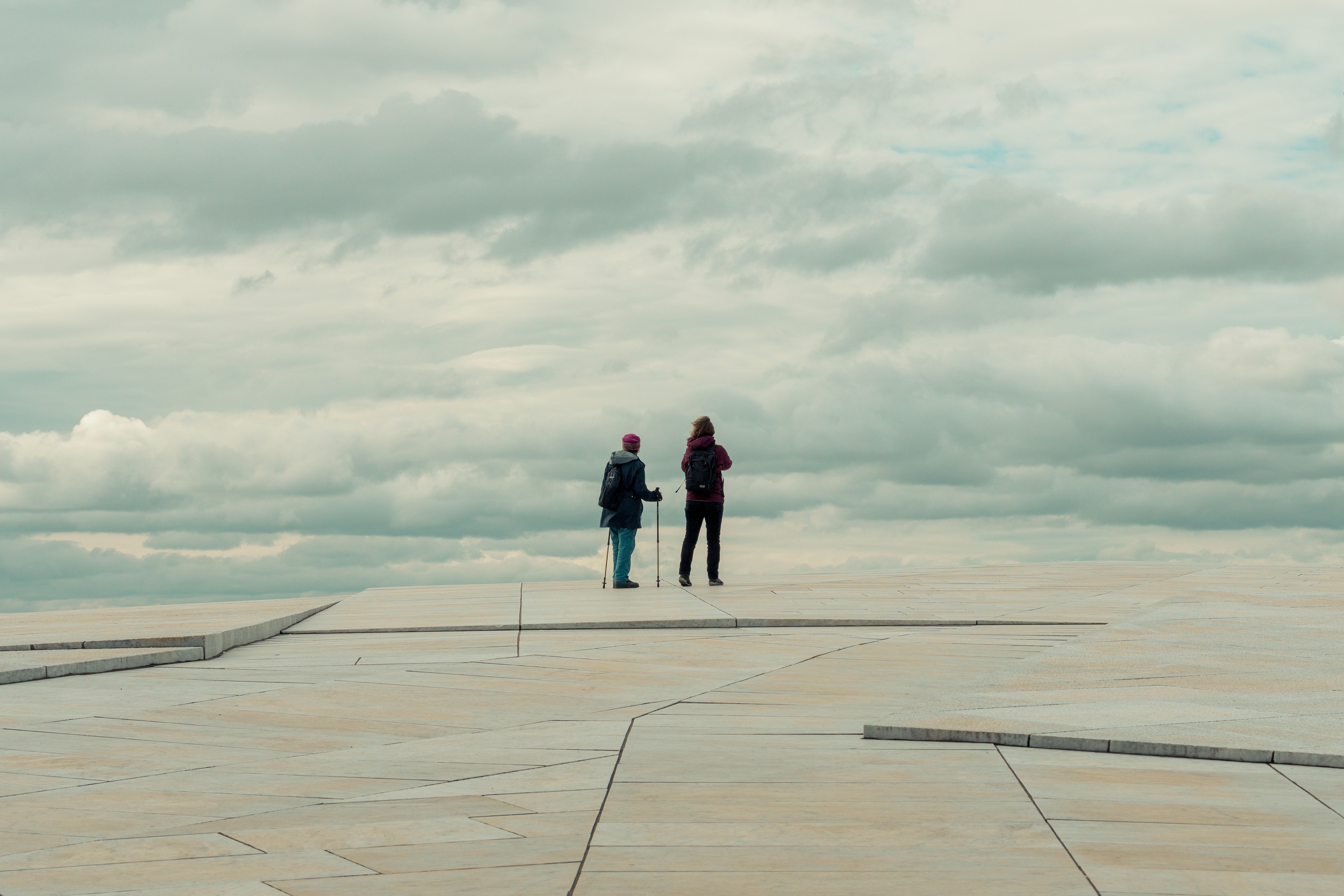 Two women standing on top of Opera in Oslo.