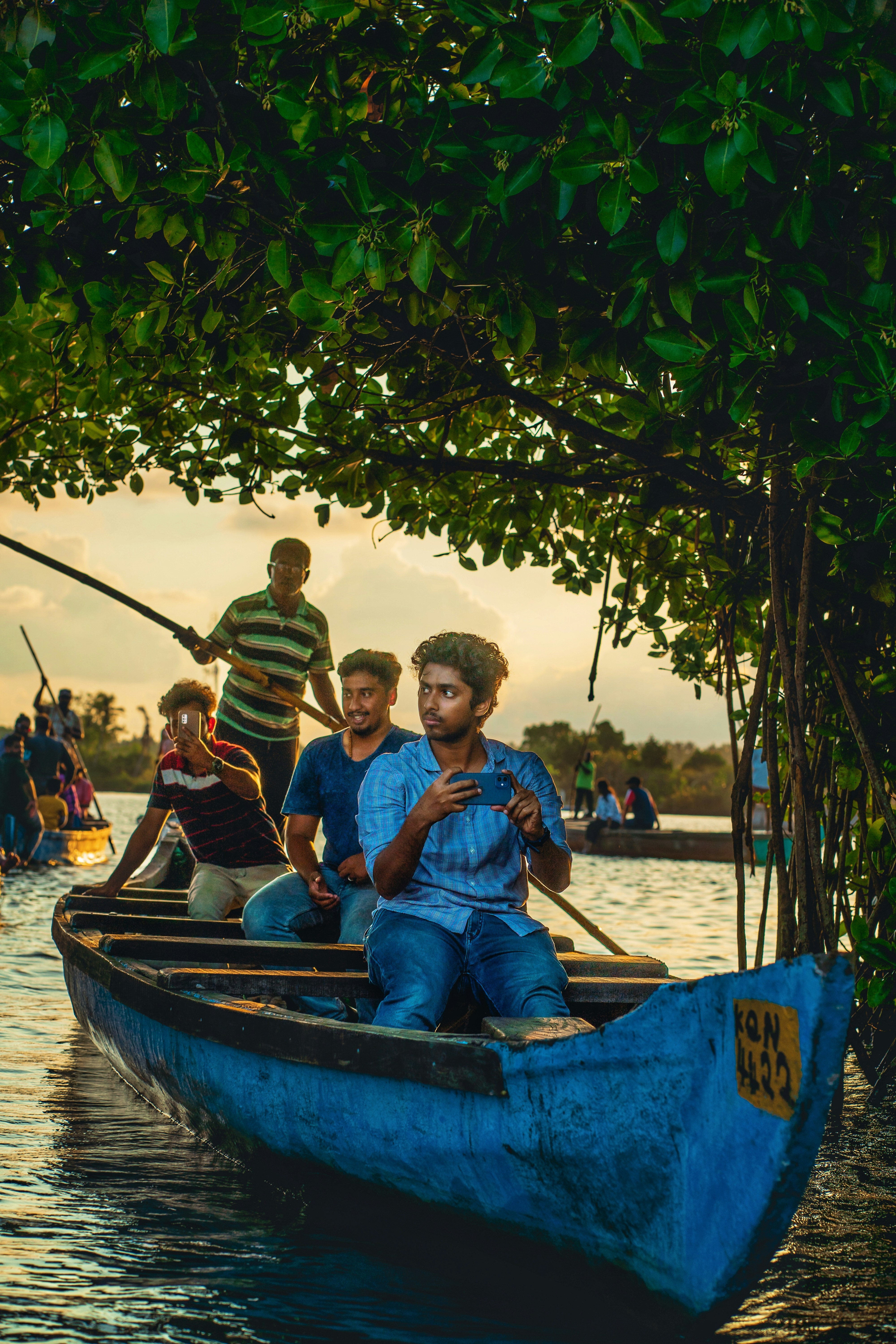 A group of people on a boat photo – Free Munroe island Image on Unsplash