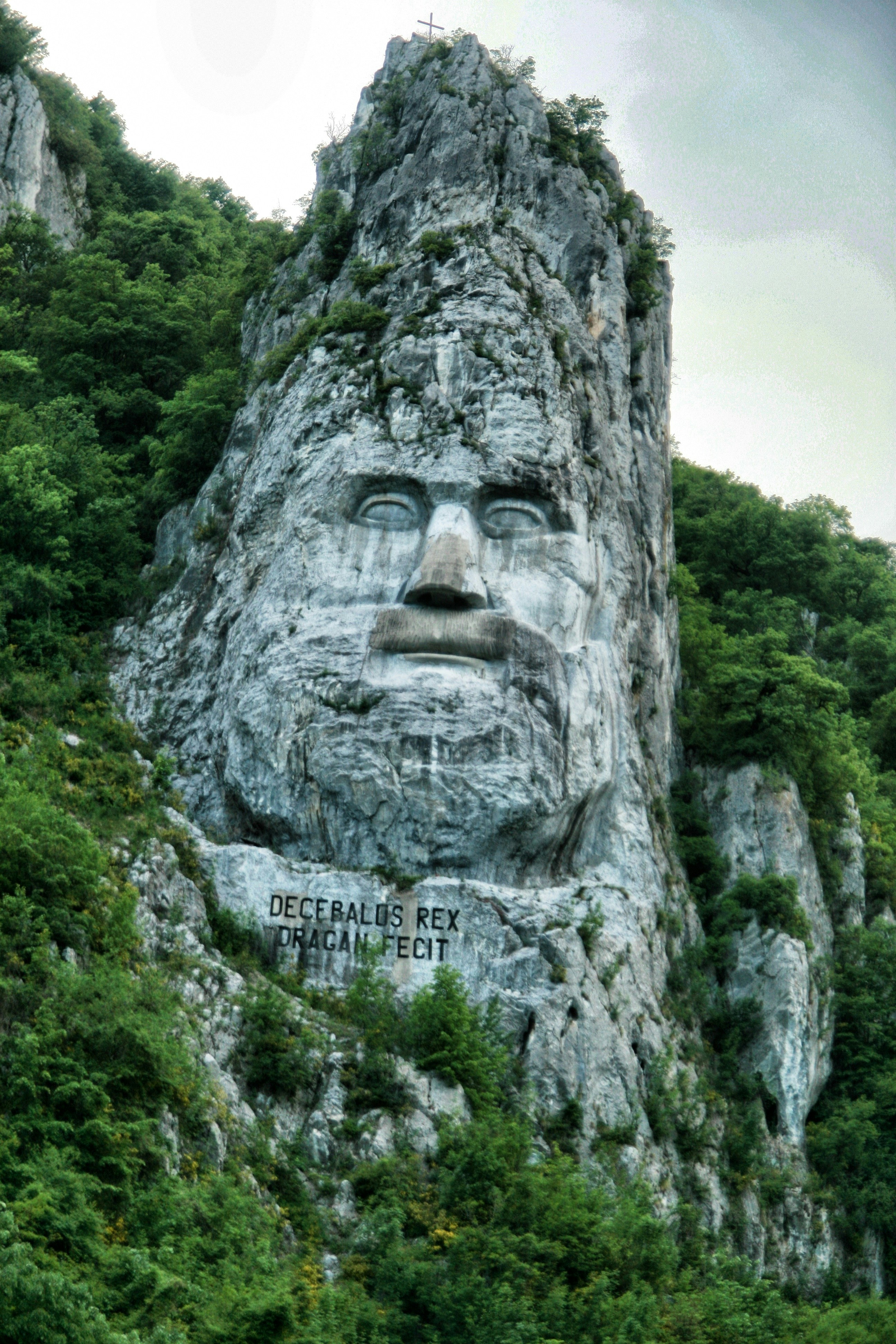 A large rock with a face carved into it photo – Free Cazanele dunării ...