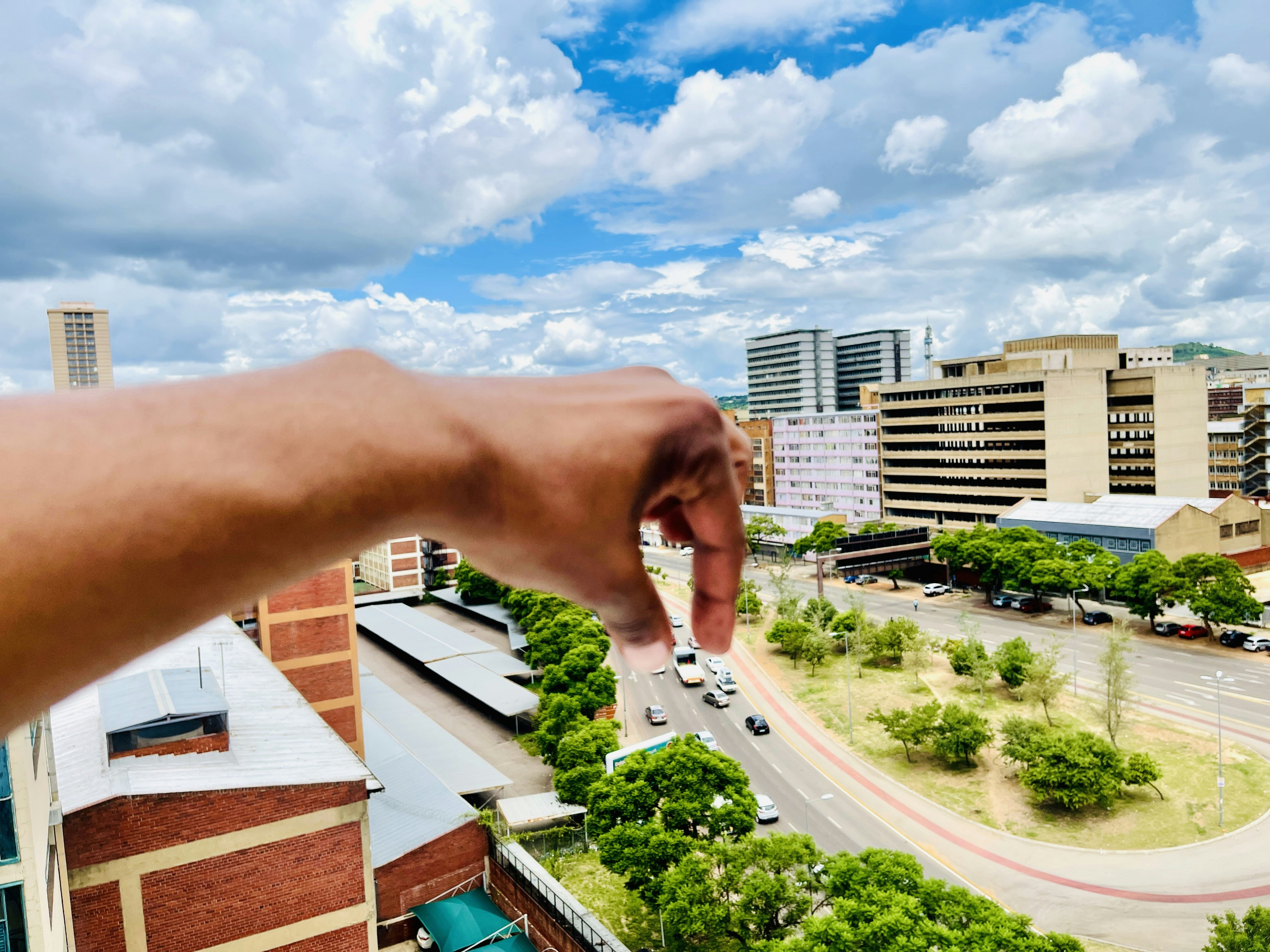 A hand holding a building photo – Free Person Image on Unsplash
