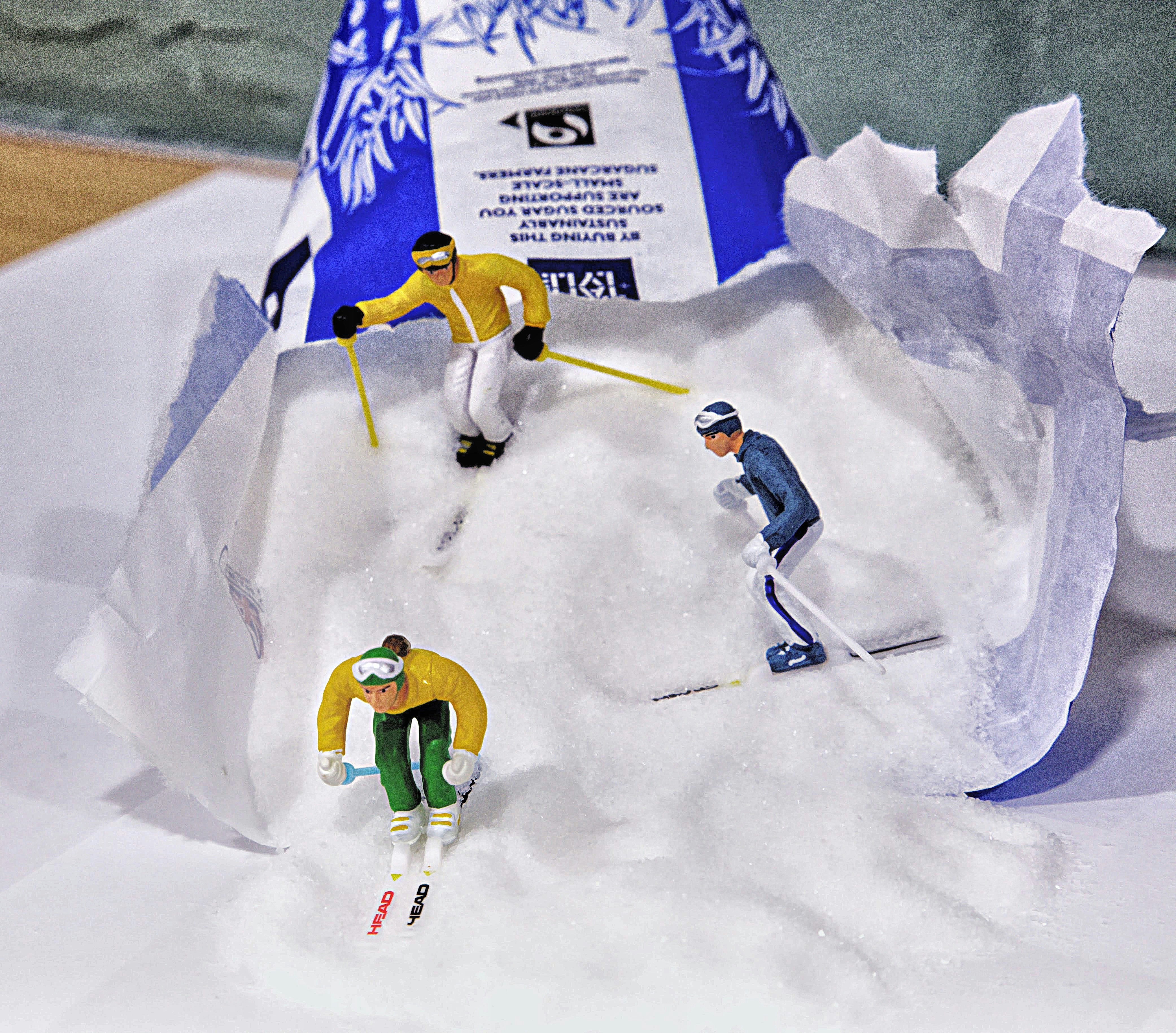 Miniature Ski Scene in a Snowy Page Corner