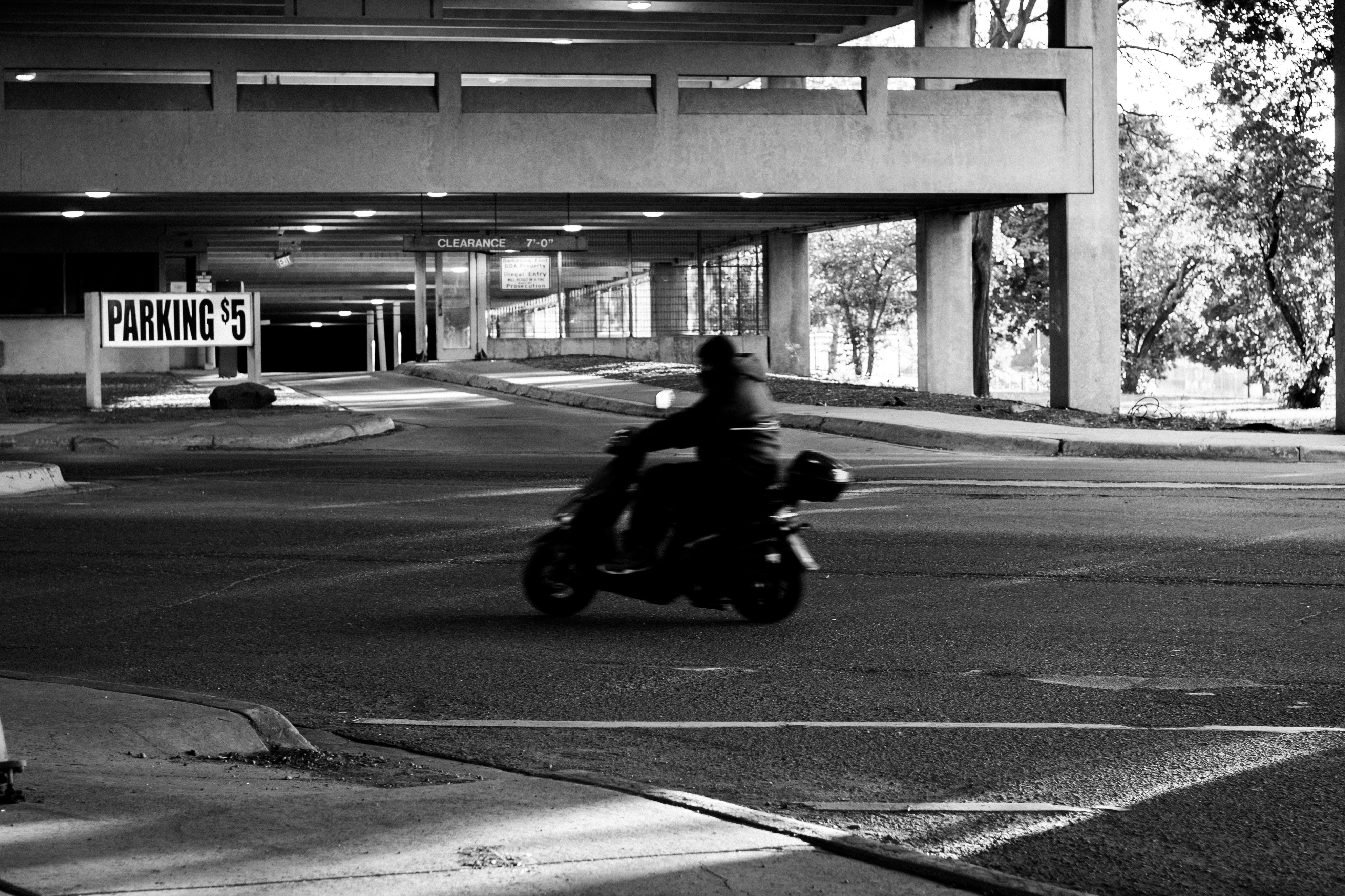Underpass Velocity: a lone rider etched in motion through concrete shadows