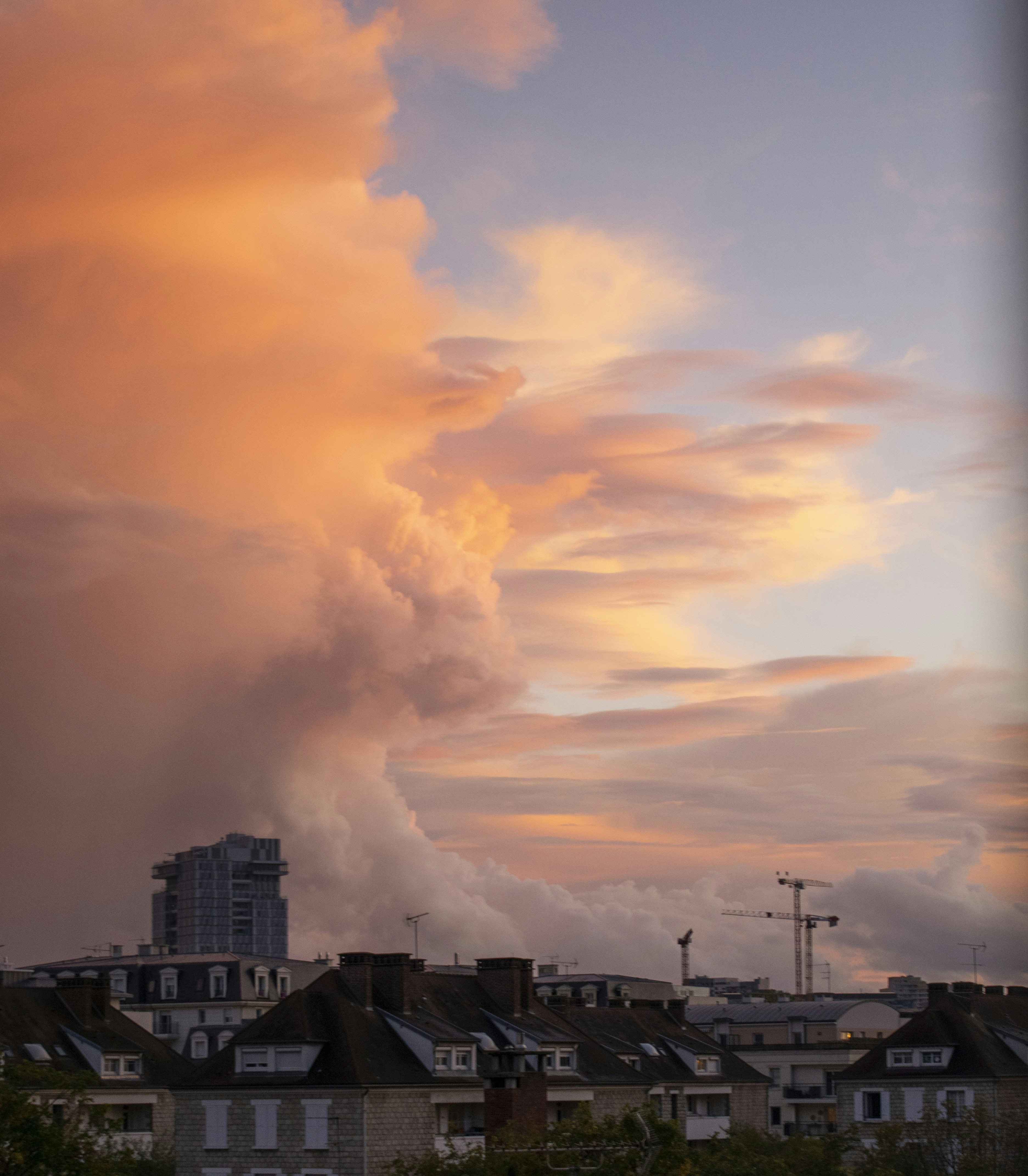 Crimson Cloudscape Over the Rooftop Horizon