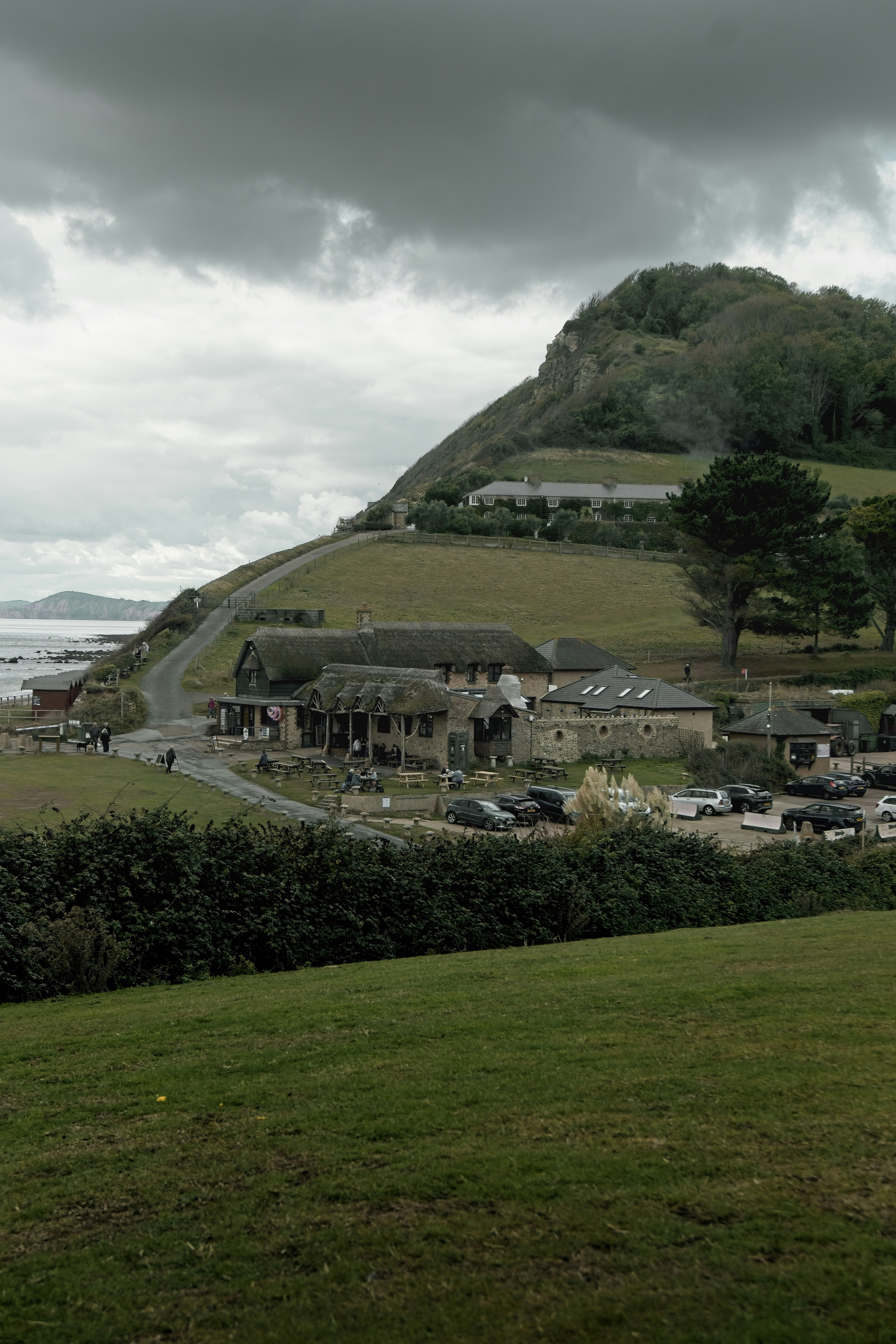 a building with a hill in the background