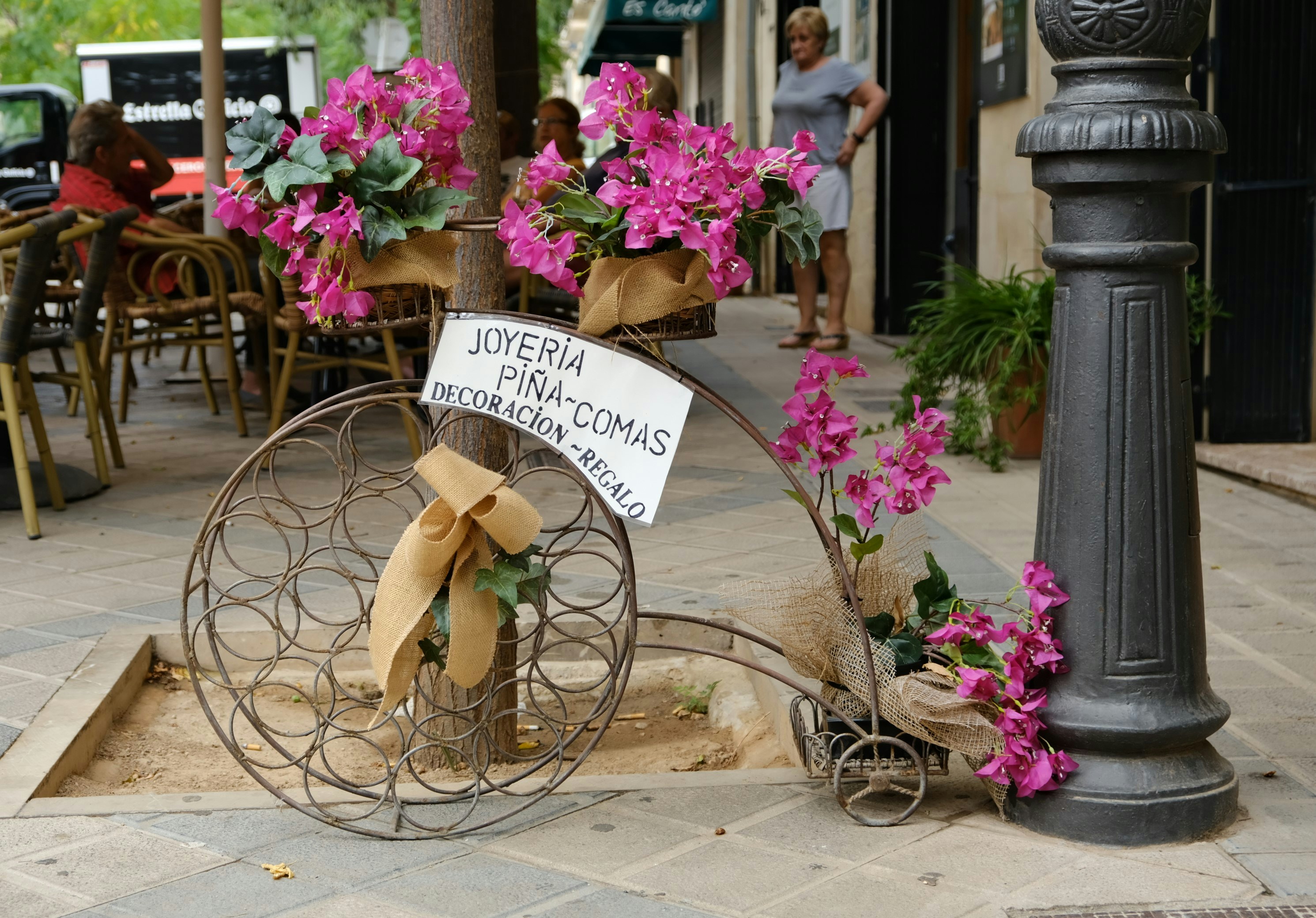 Iron Cycle of Blooms: Pink Bougainvillea on a Wrought-Iron Bicycle