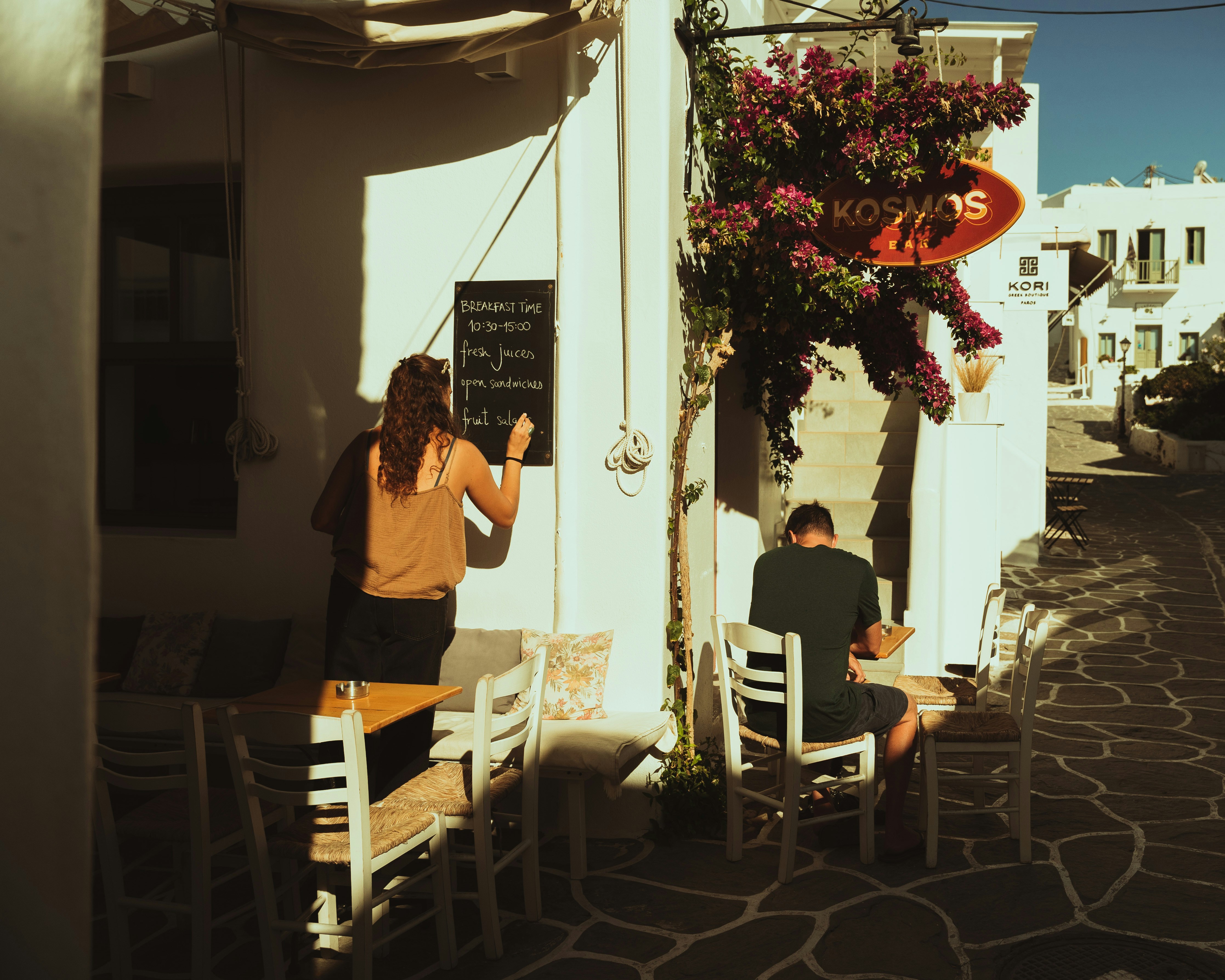 Cafe Chalkboard and Sunlit Alley in Mediterranian Light