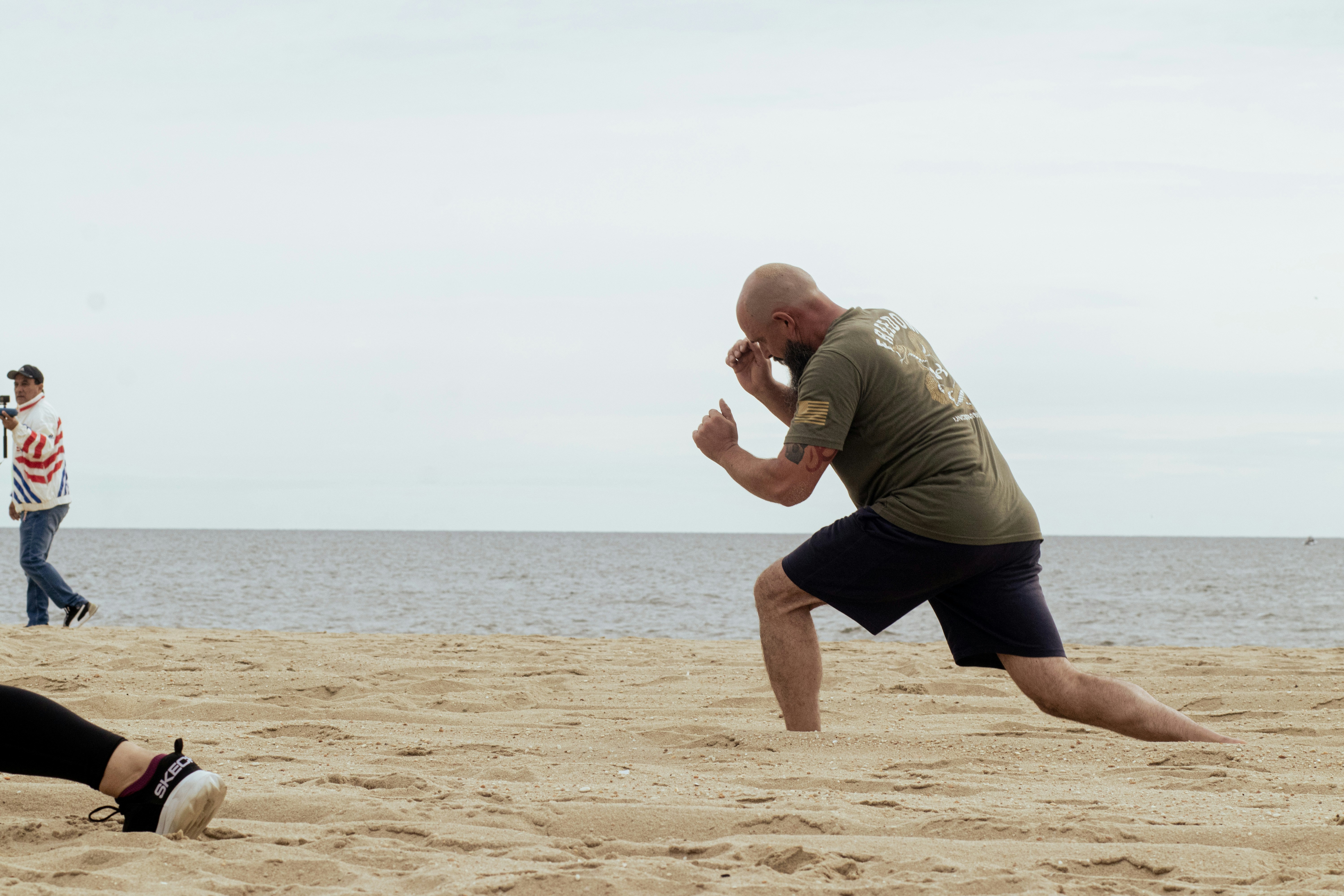 A person running on a beach photo – Free Fighting Image on Unsplash