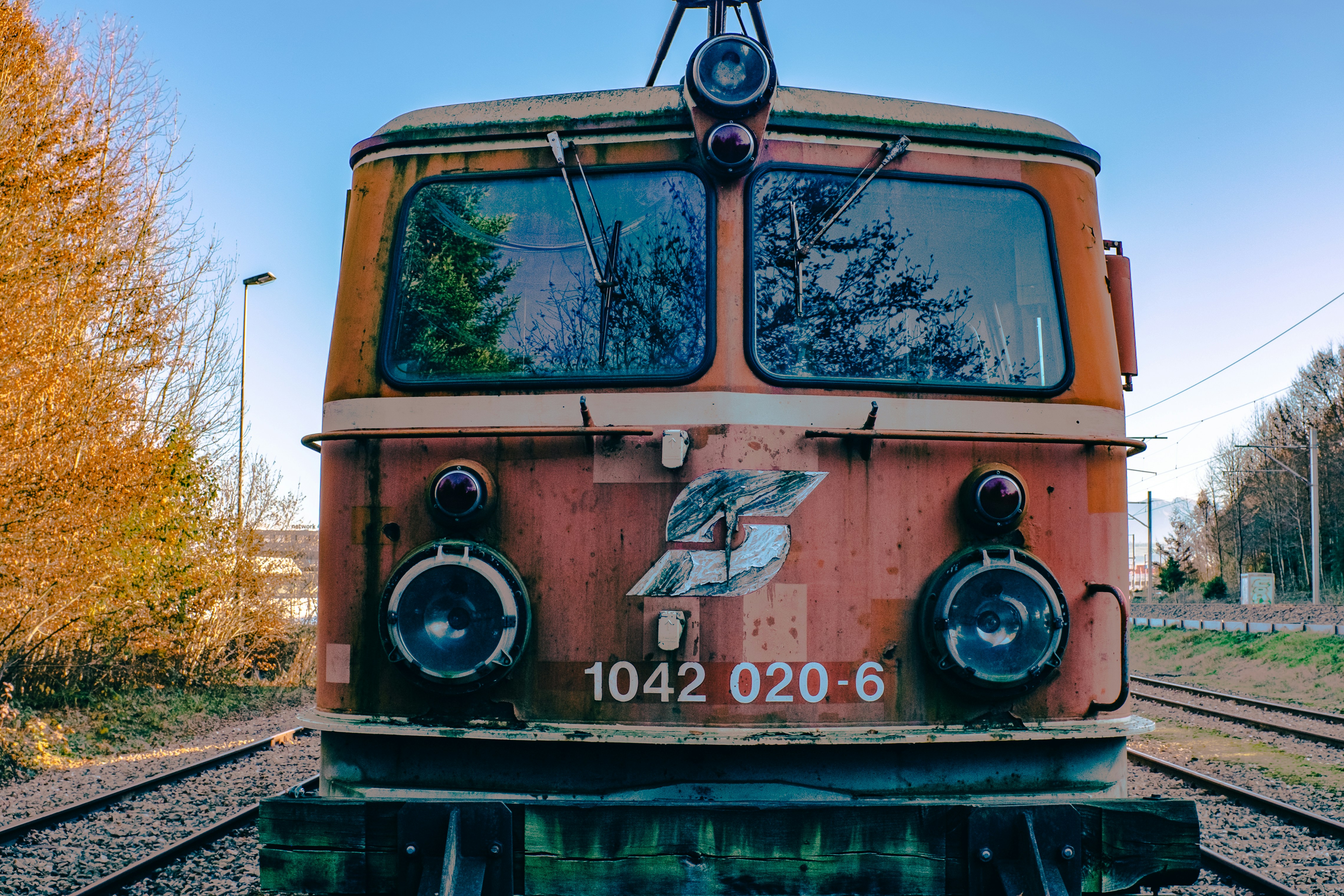 Front-on Rust: Weathered Diesel Loco on Quiet Rails
