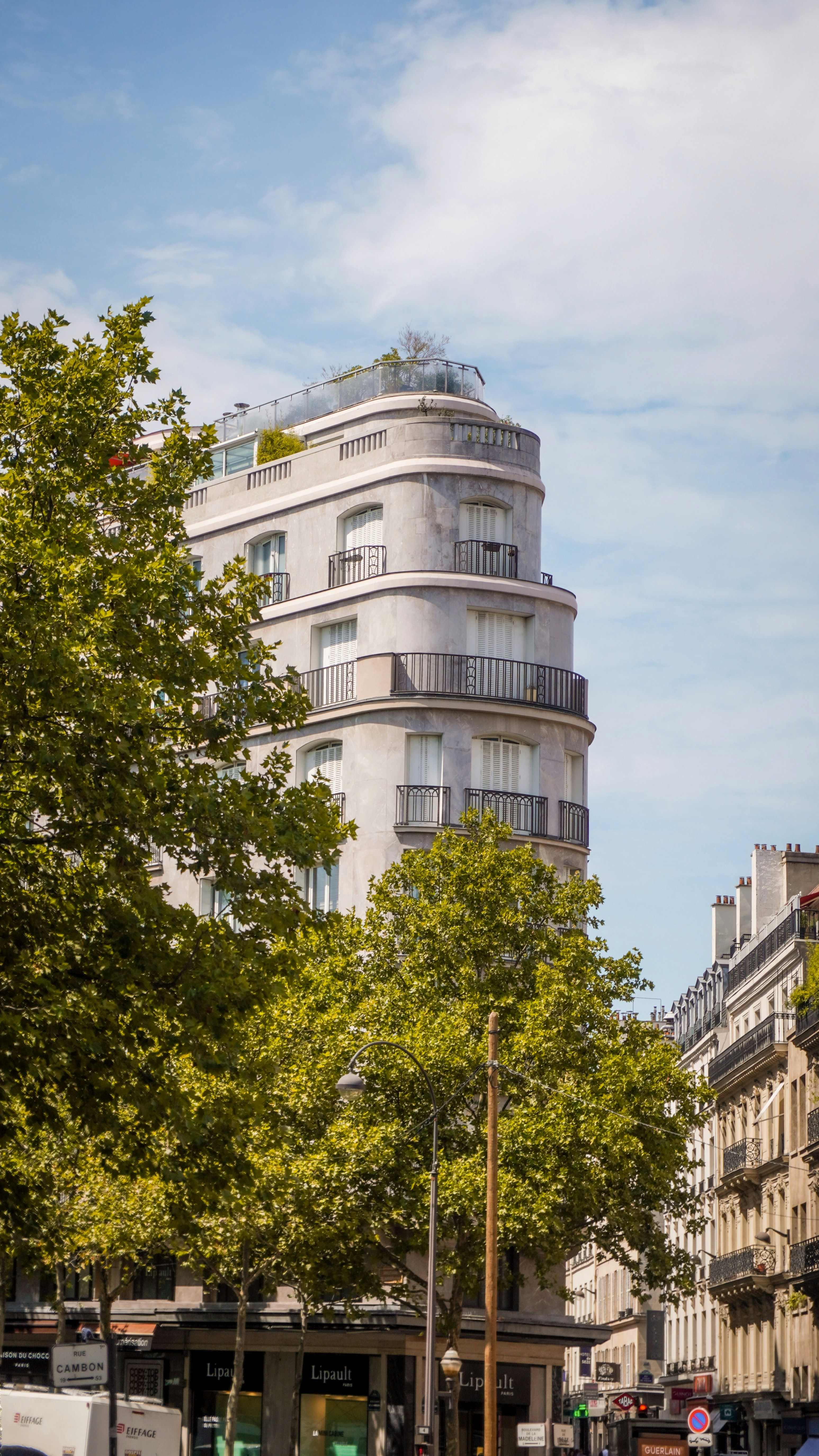 A building with trees in front of it photo – Free Paris Image on Unsplash