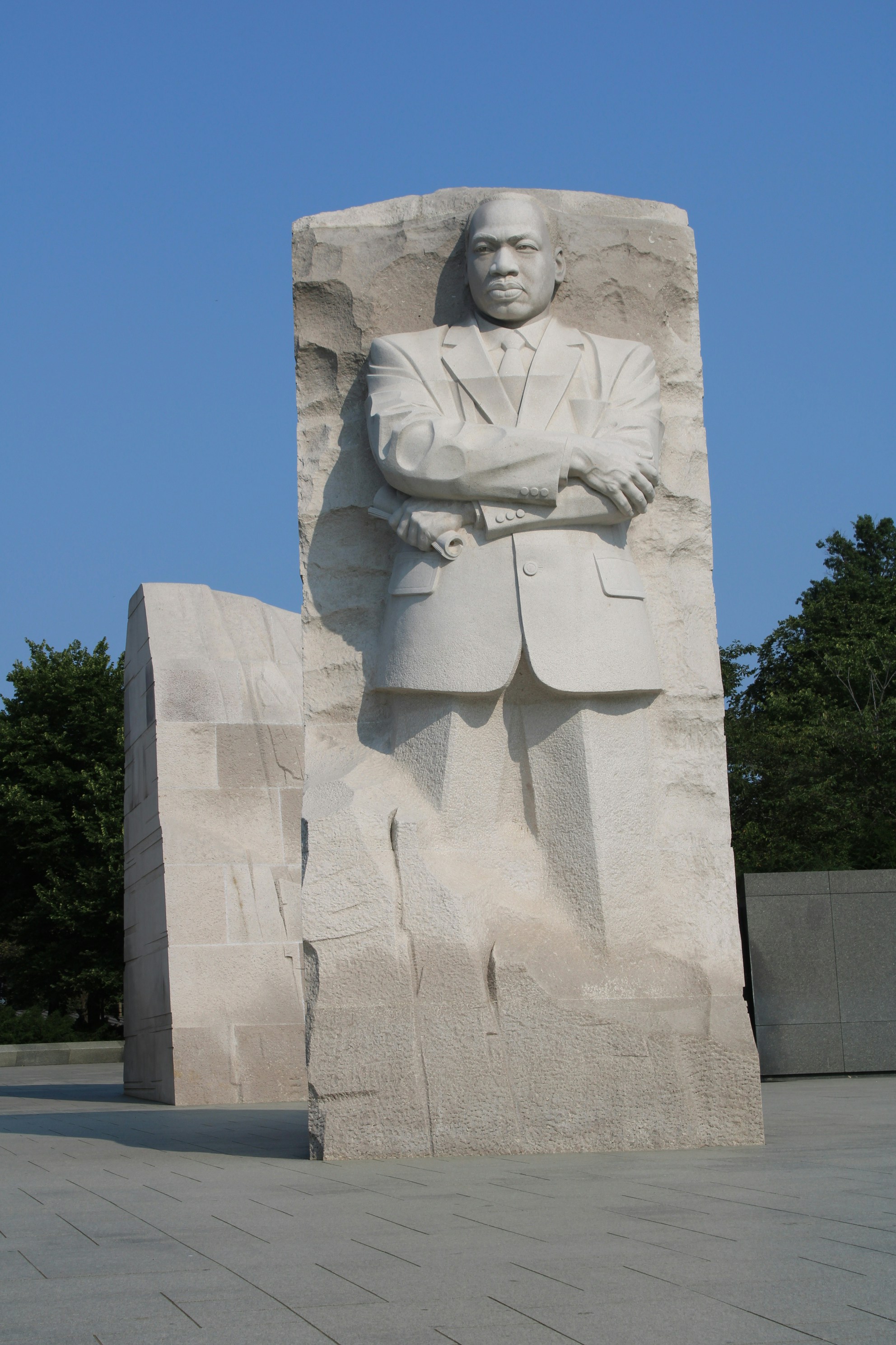 A statue of a person with Martin Luther King Jr. Memorial in the ...