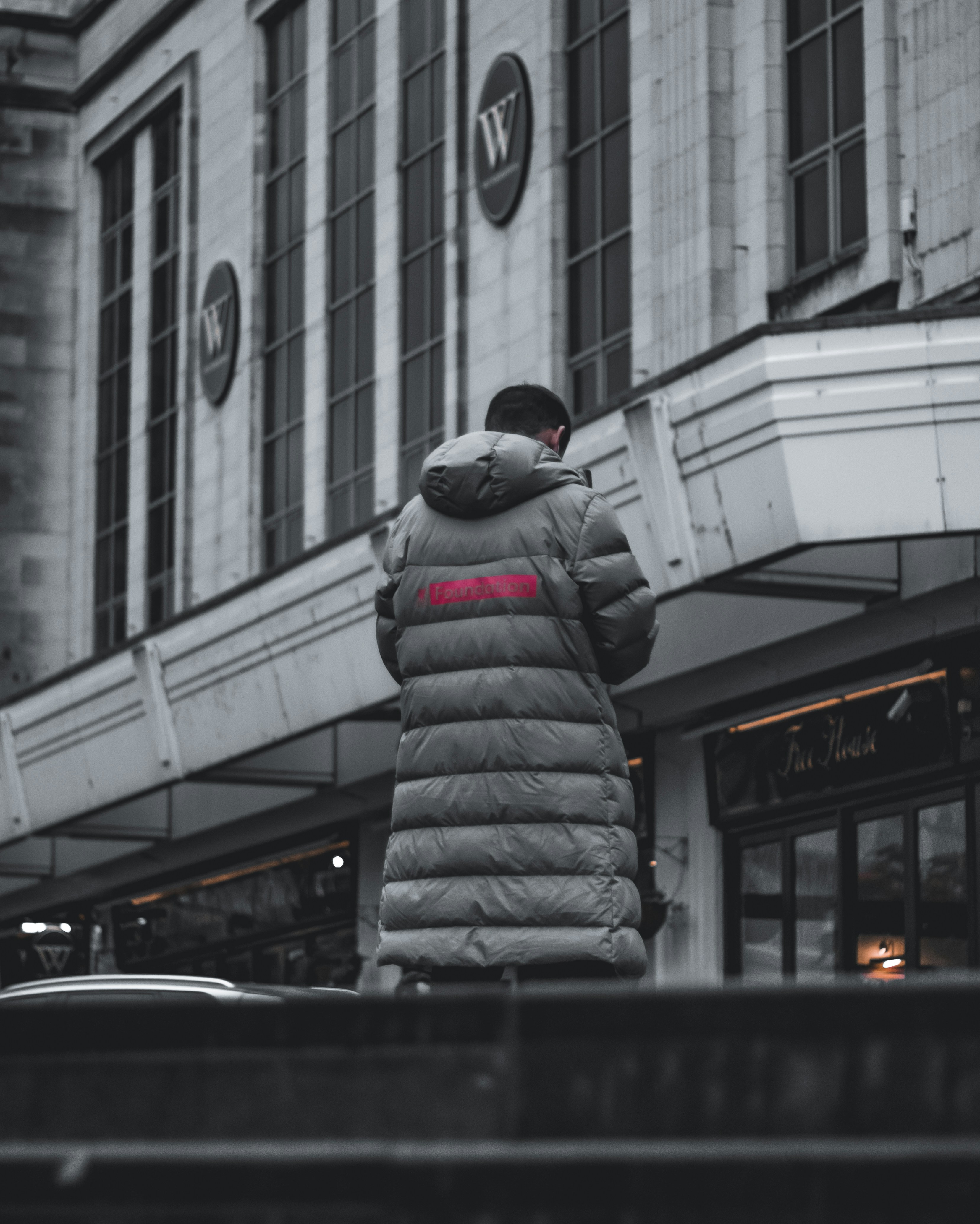 a statue of a person in front of a building