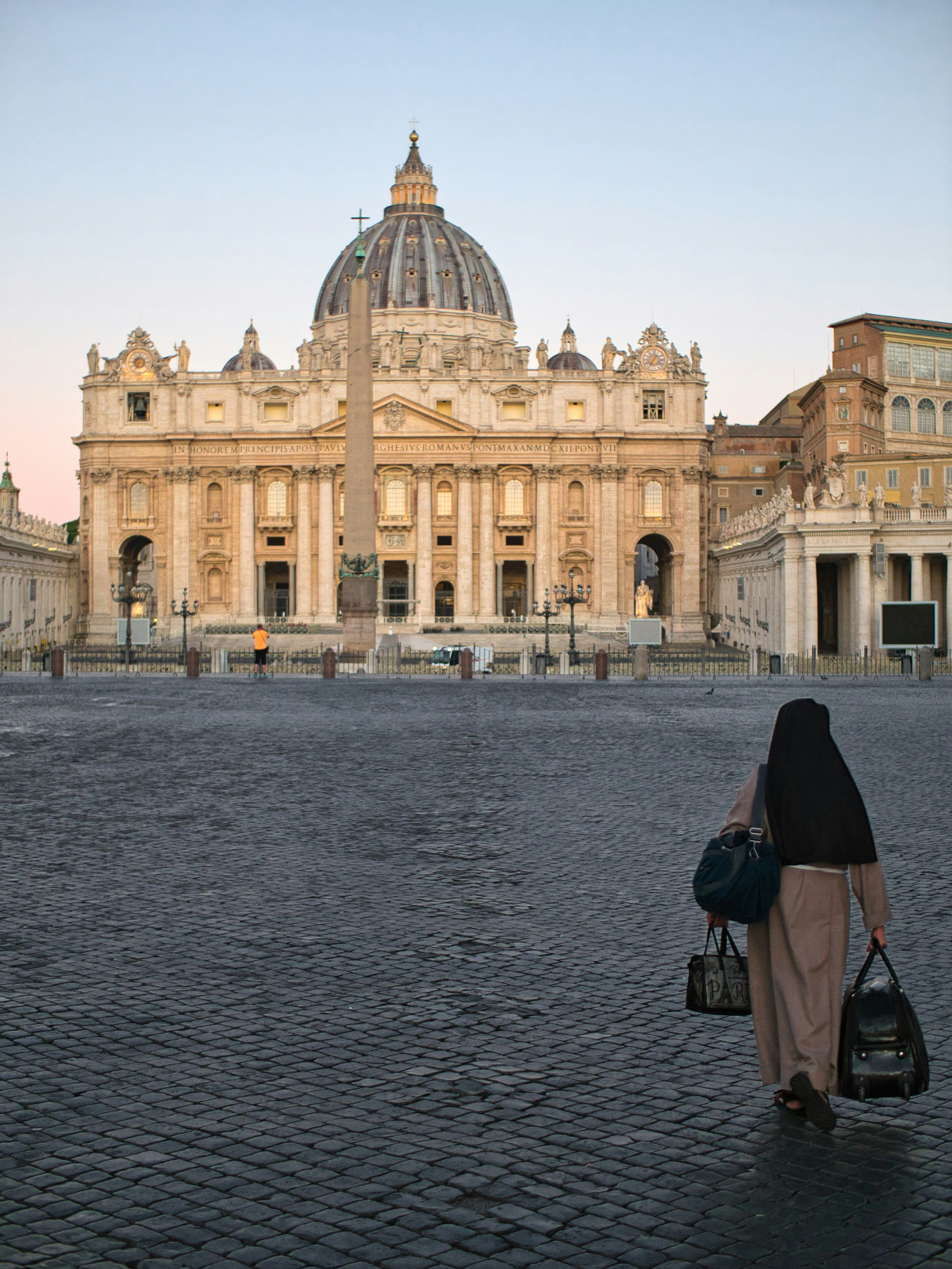 A person standing in front of a large building photo – Free Rome Image ...