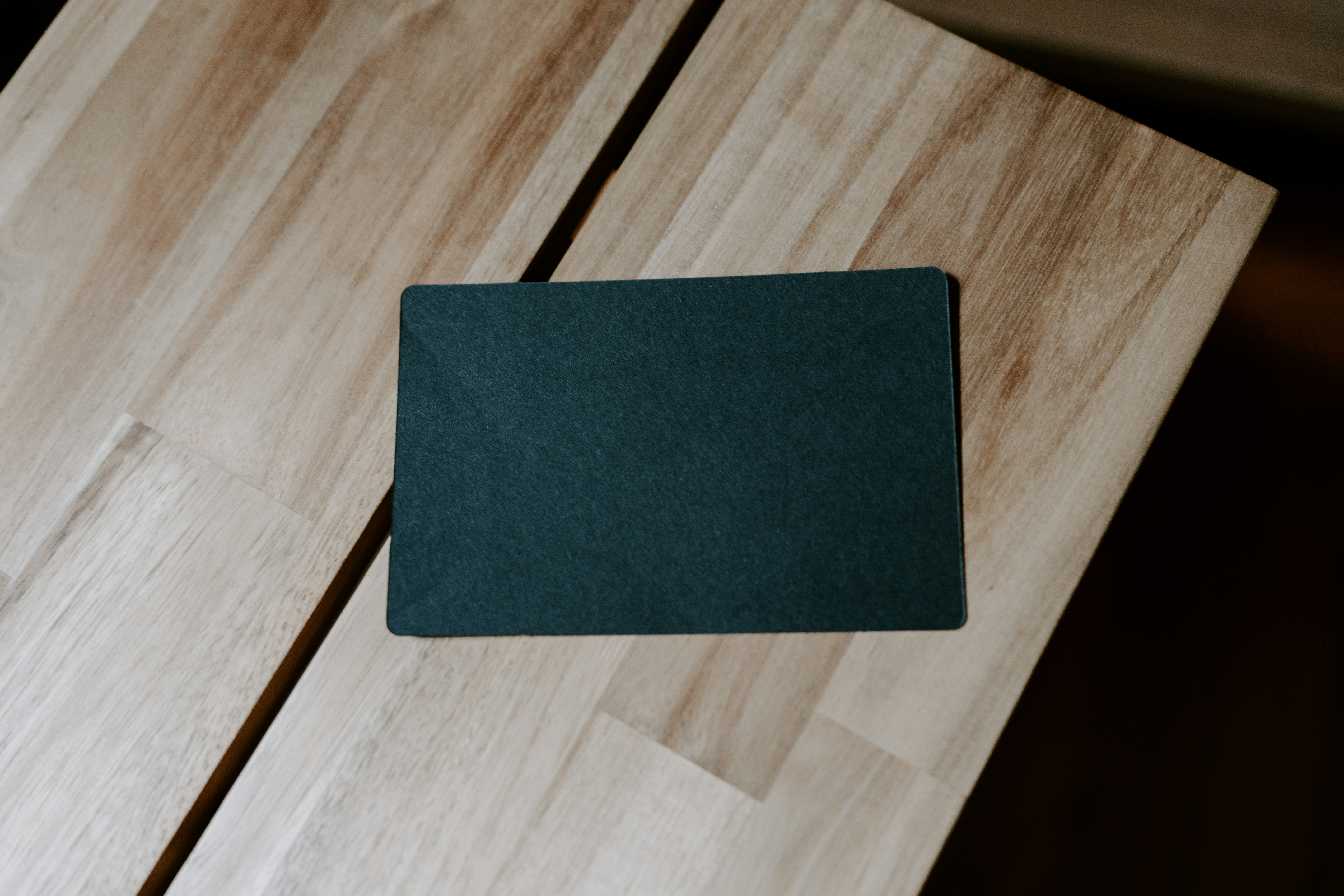 A blue square object on a wooden surface photo – Free Grey Image on ...