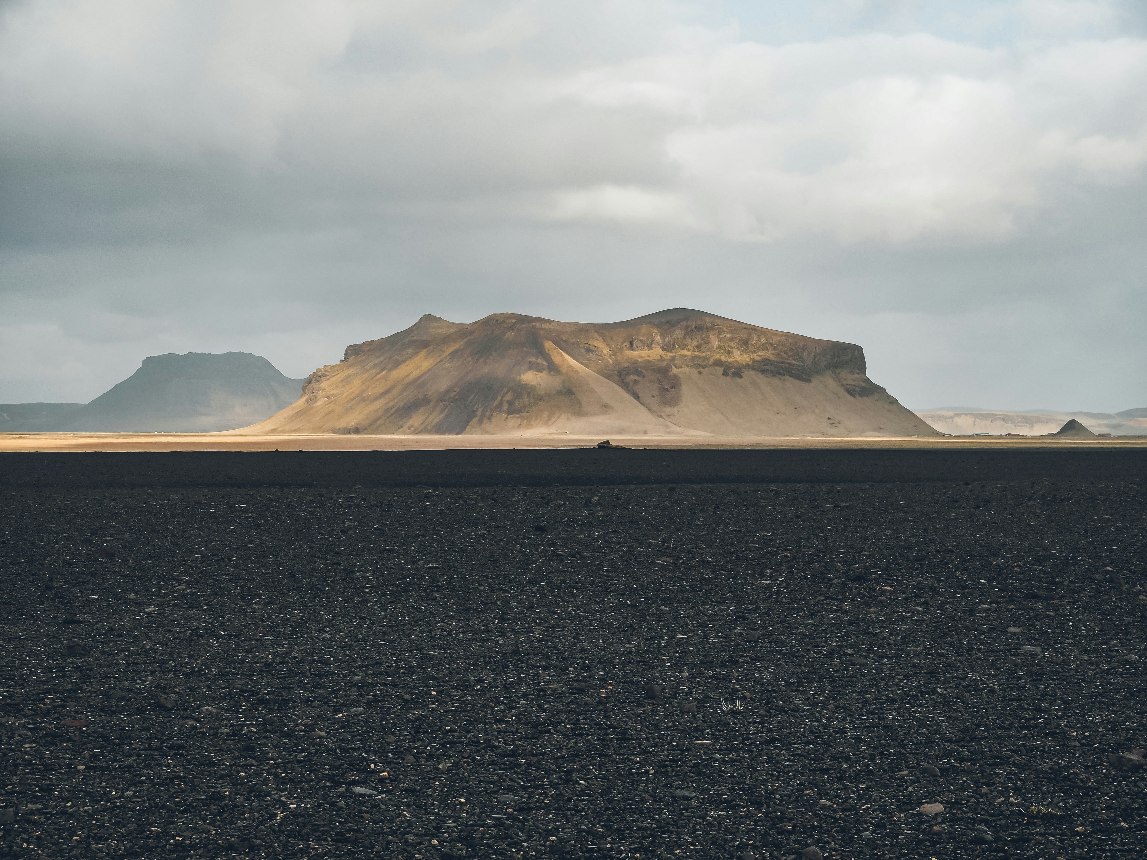A large flat area with hills in the distance photo – Free Landscape ...