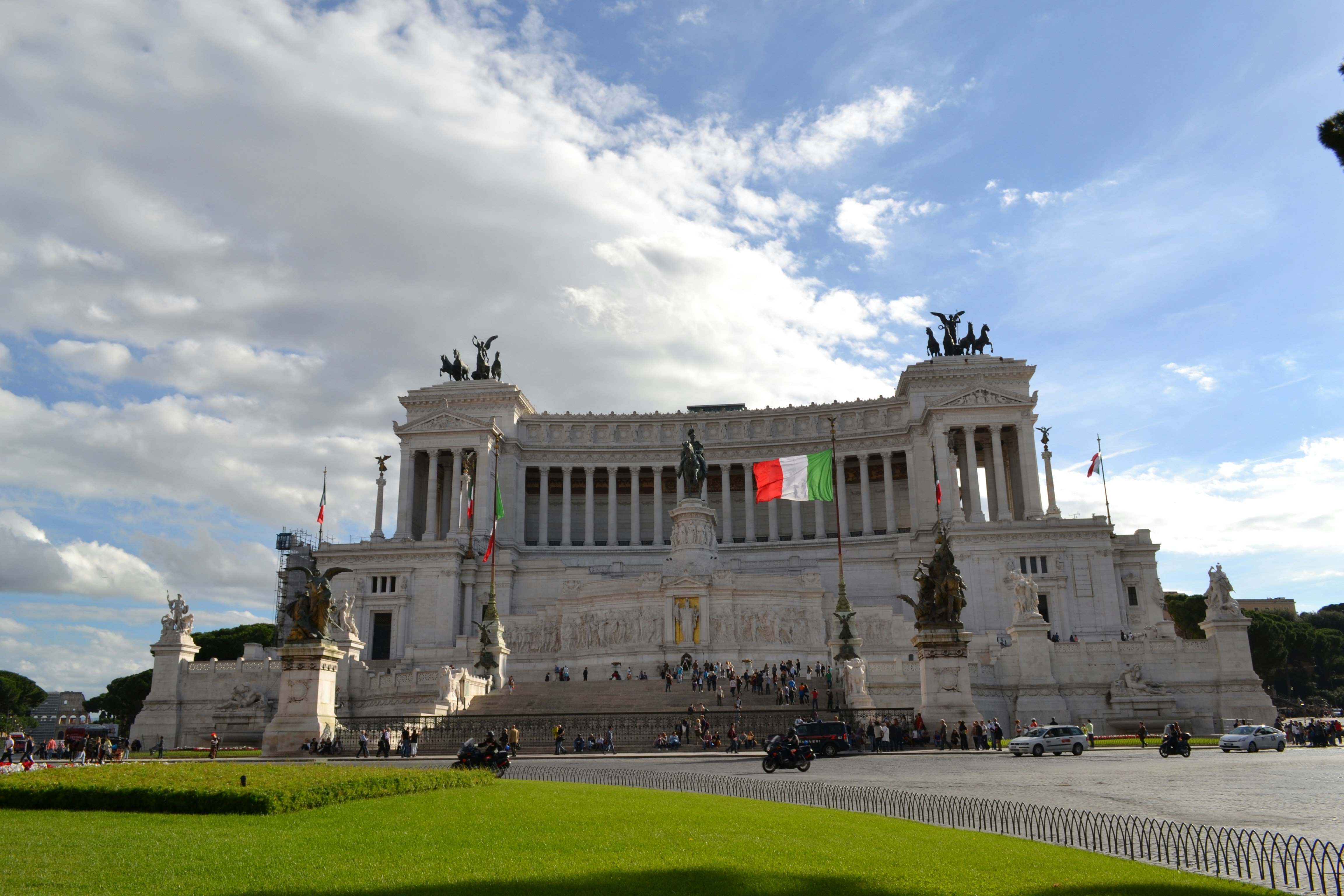 The Altare della Patria stands proudly in Rome, adorned with flags and intricate sculptures, showcasing Italy's rich heritage.