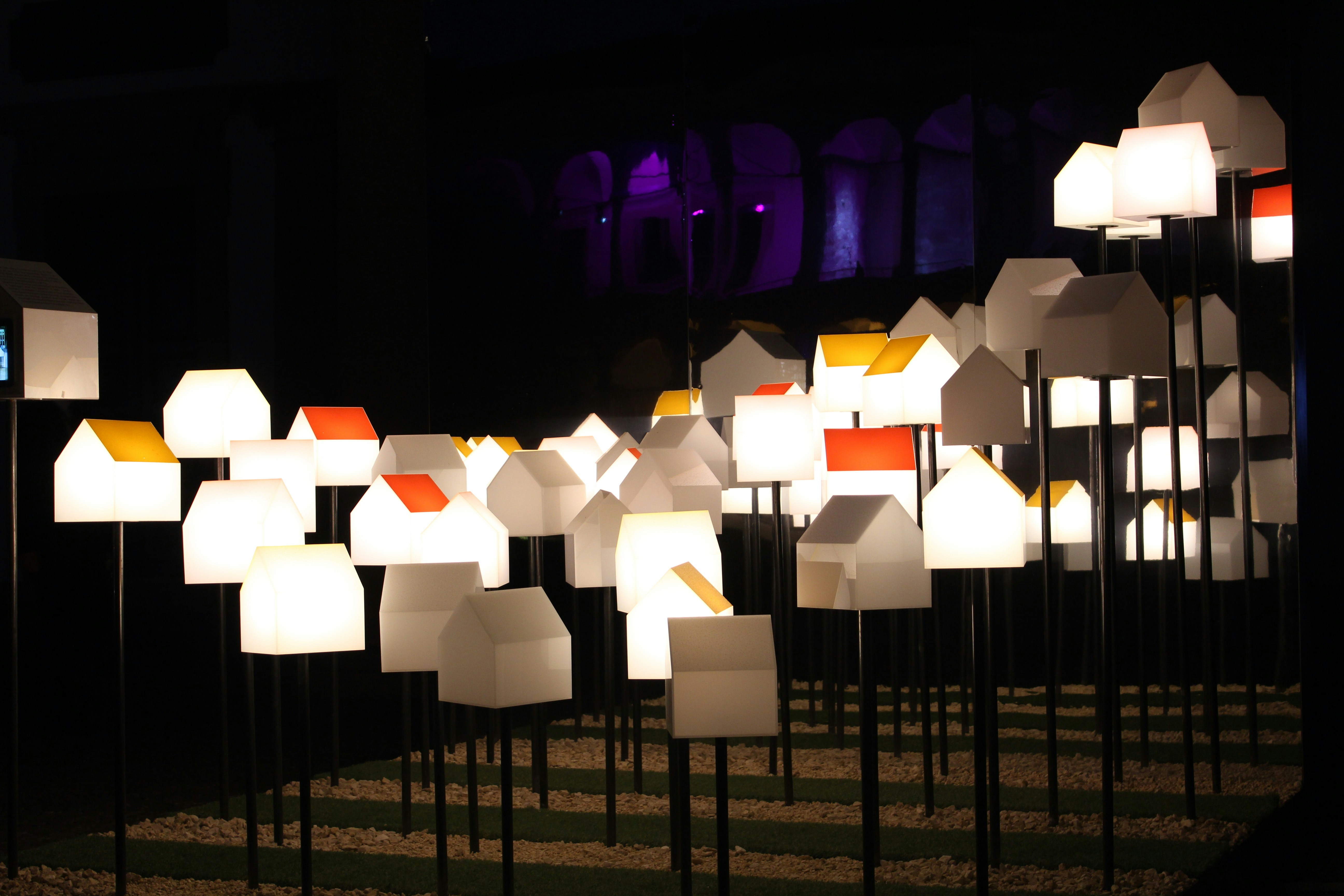 Lantern Field at Dusk: Warm Orbs Rising Among Shadowed Stalks