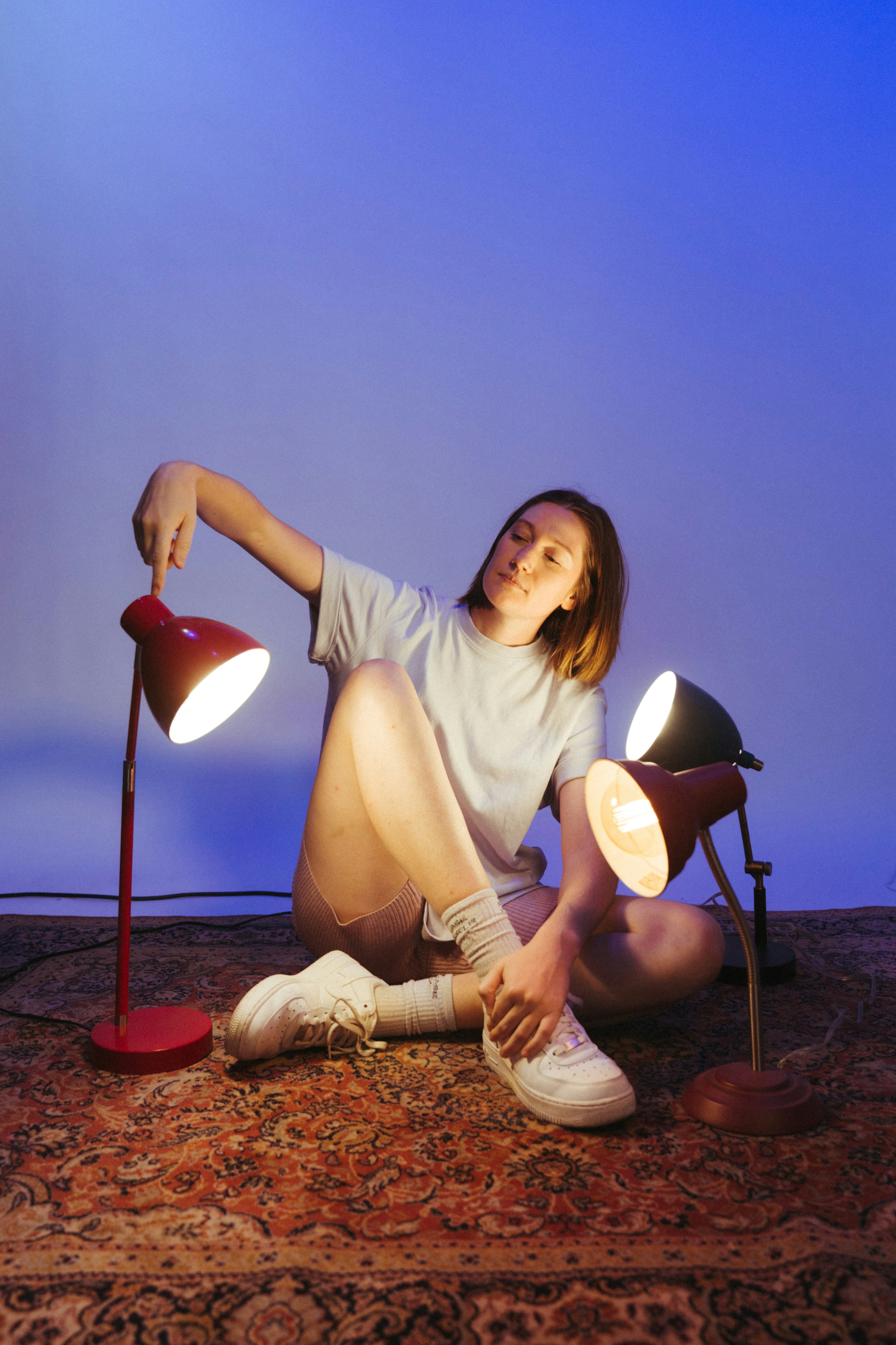Studio Night: A Quiet Portrait amid Copper Lamps