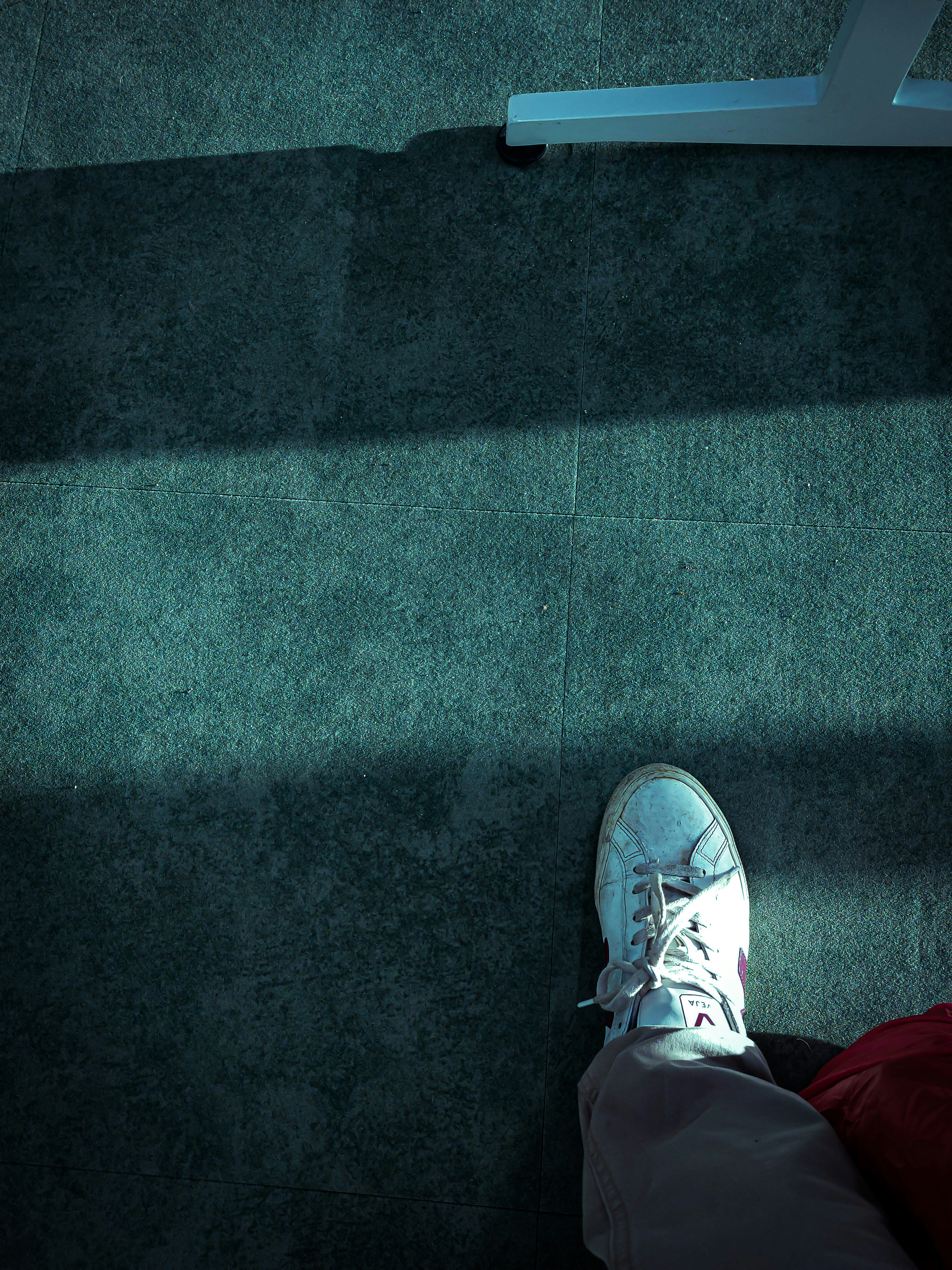 a person's feet on a carpet