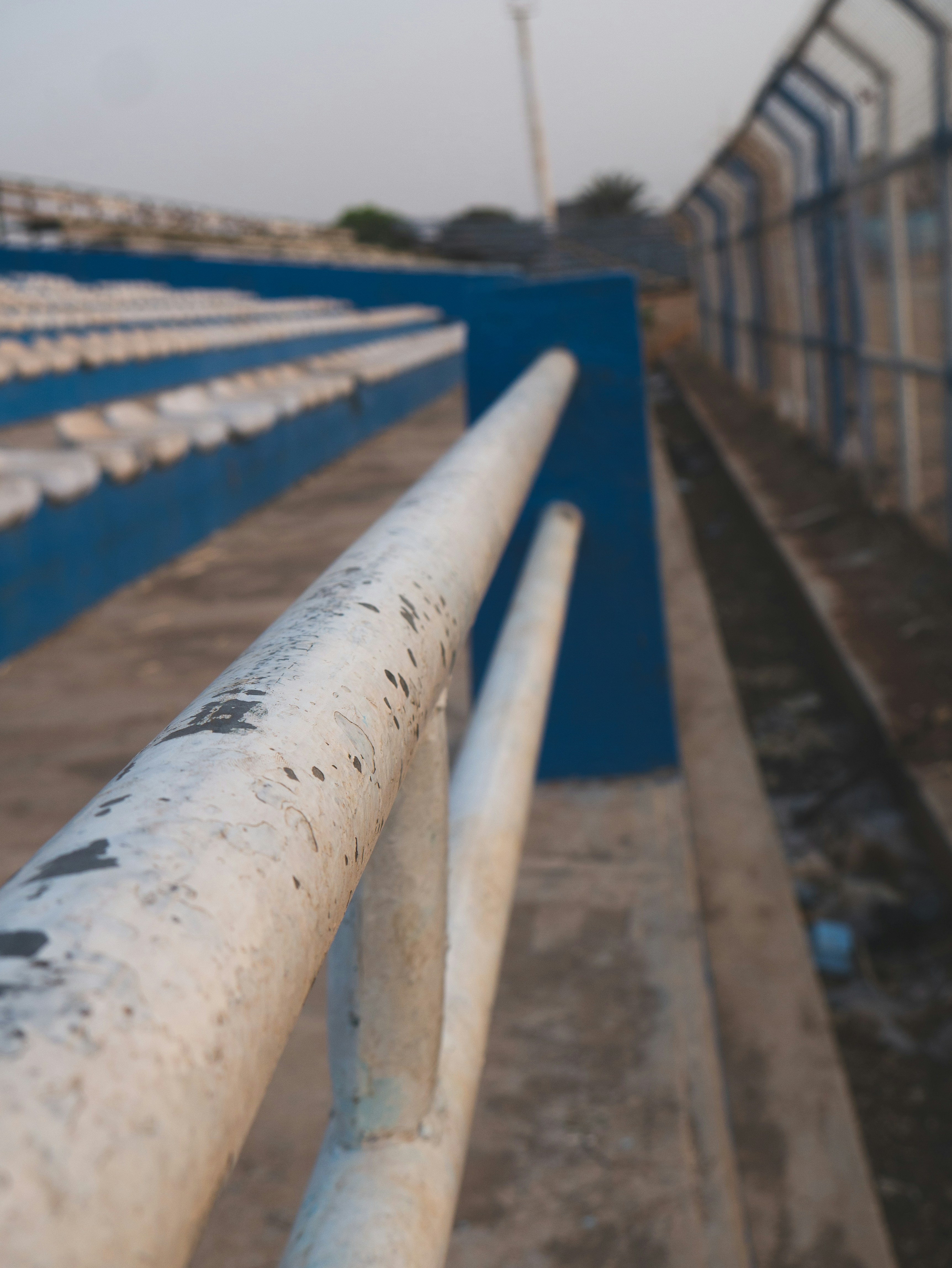A row of blue metal railings photo – Free Handrail Image on Unsplash
