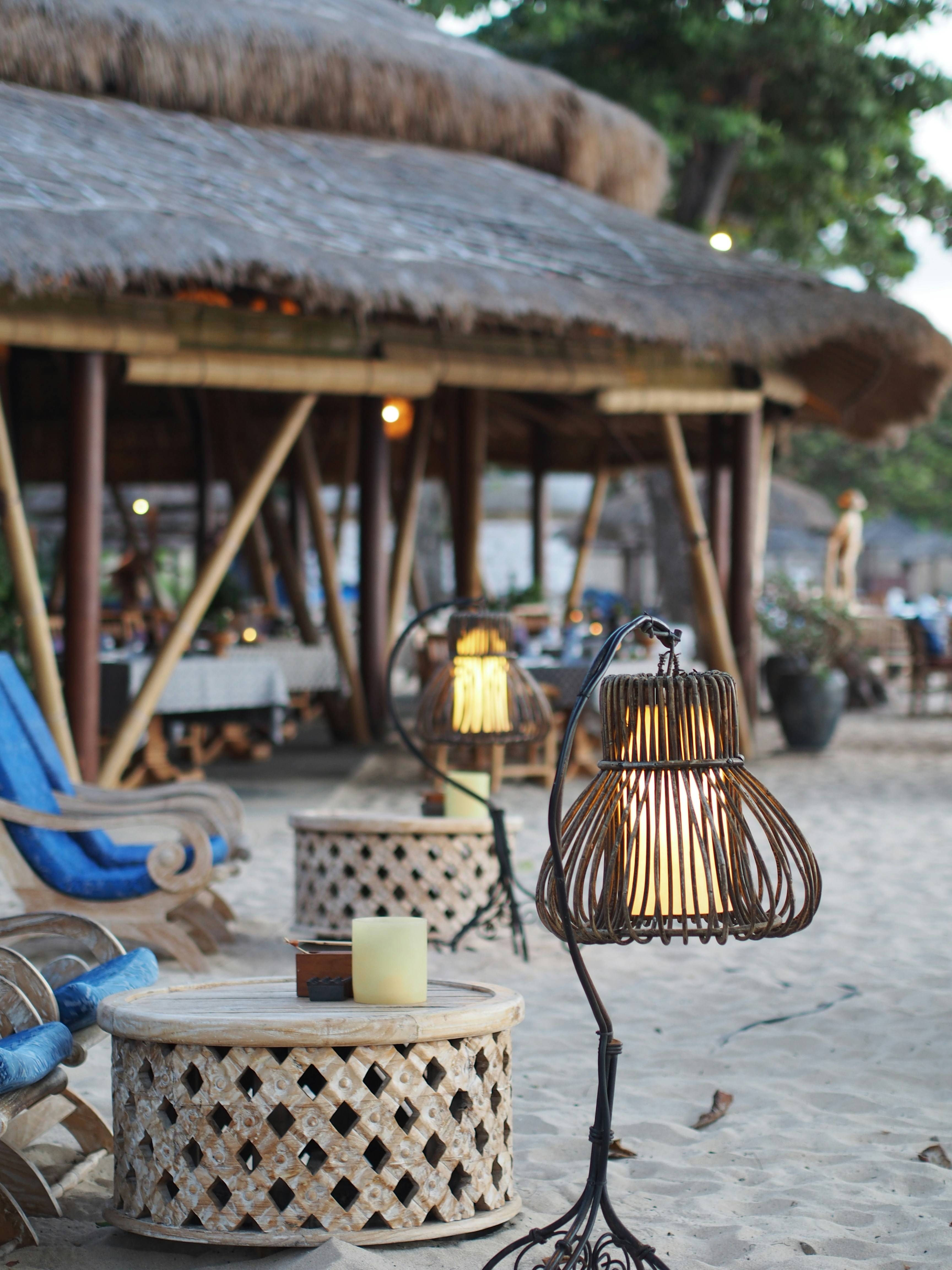 a table with a lamp and a lantern on it