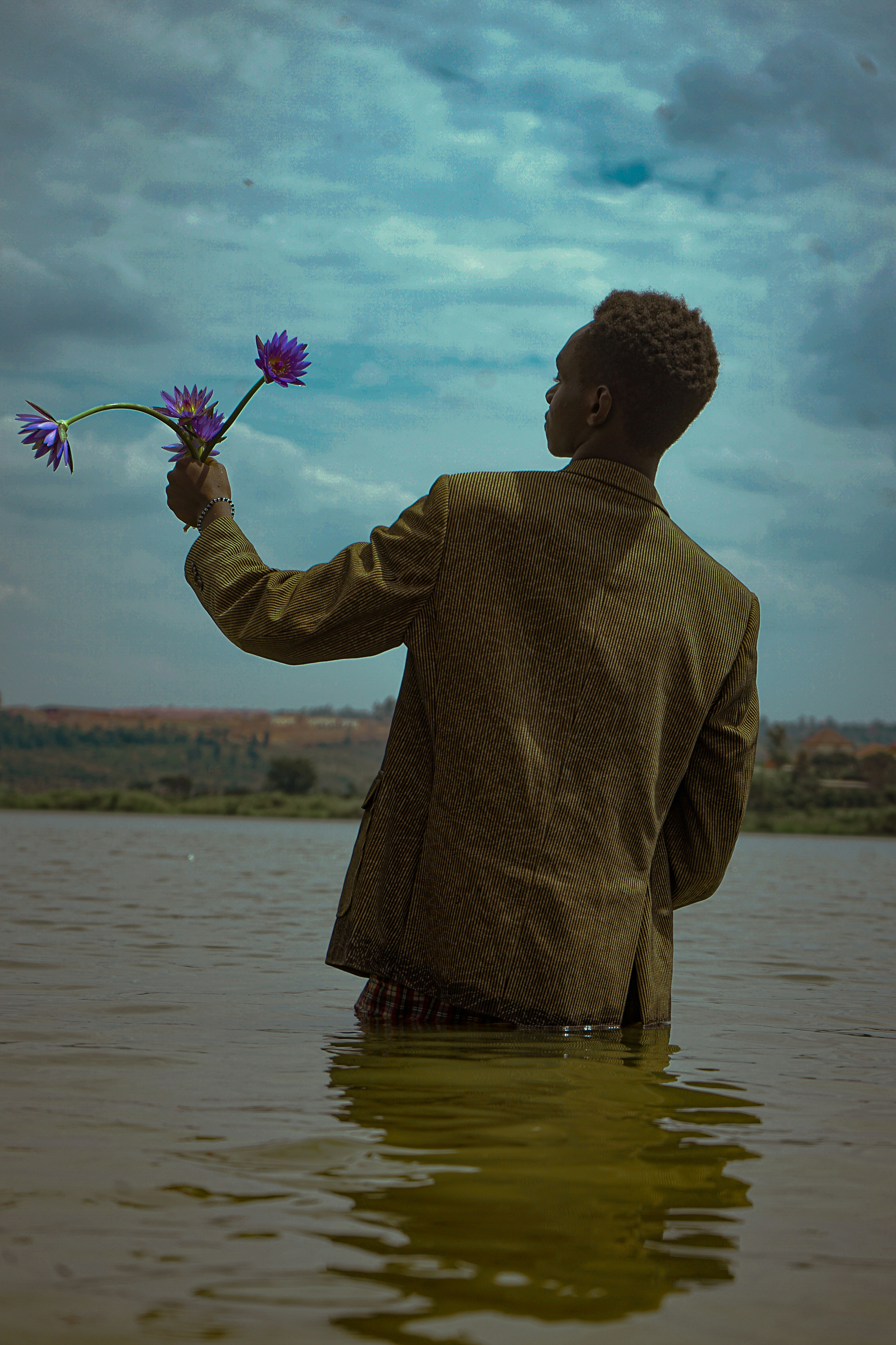 Bouquet Over the River: A Quiet Gesture Under a Wide Sky