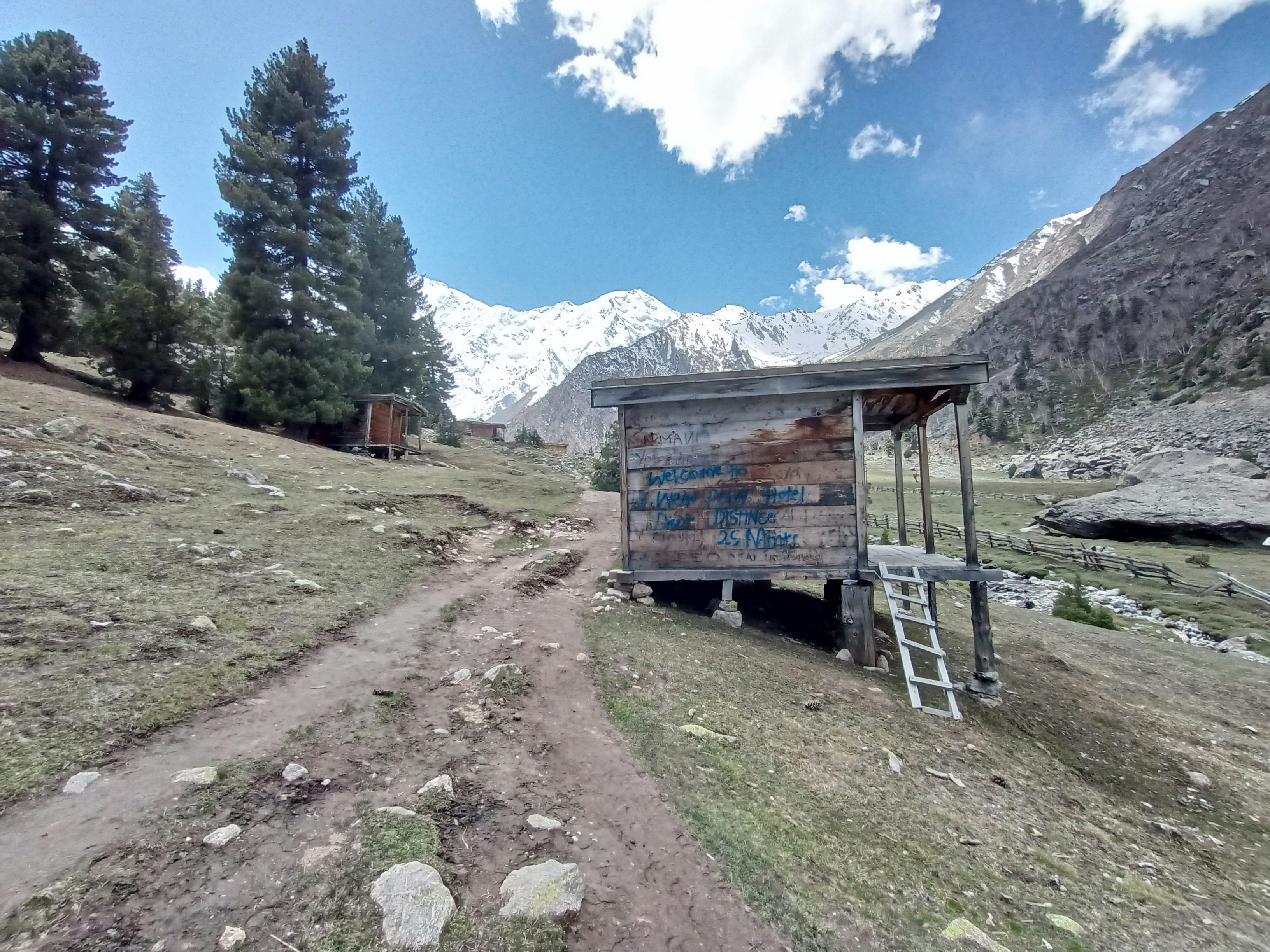 Old Cabin by Snow Mountains: A Quiet Trail Amid Peaks