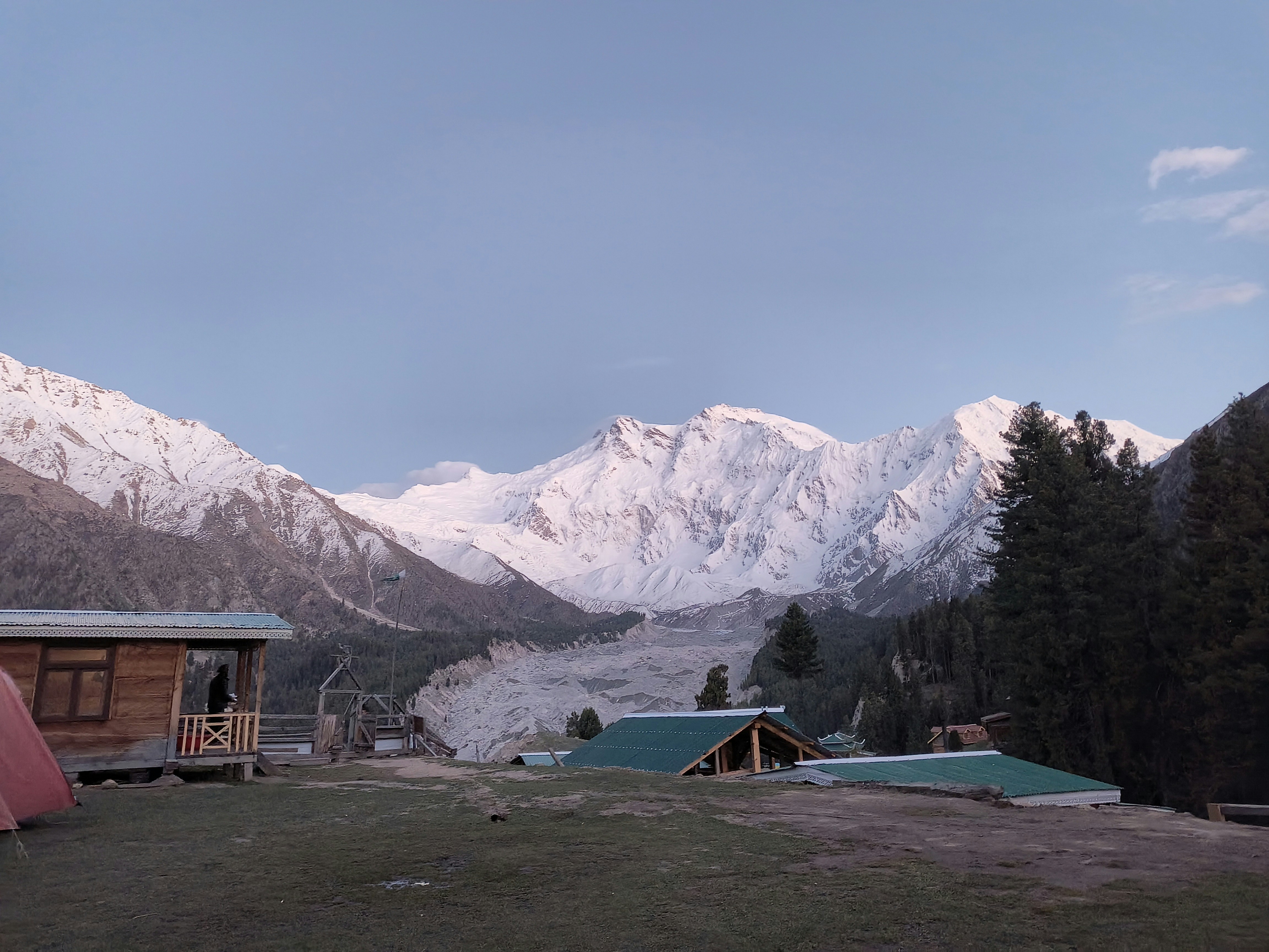 A group of buildings in front of a snowy mountain photo – Free Gilgit ...