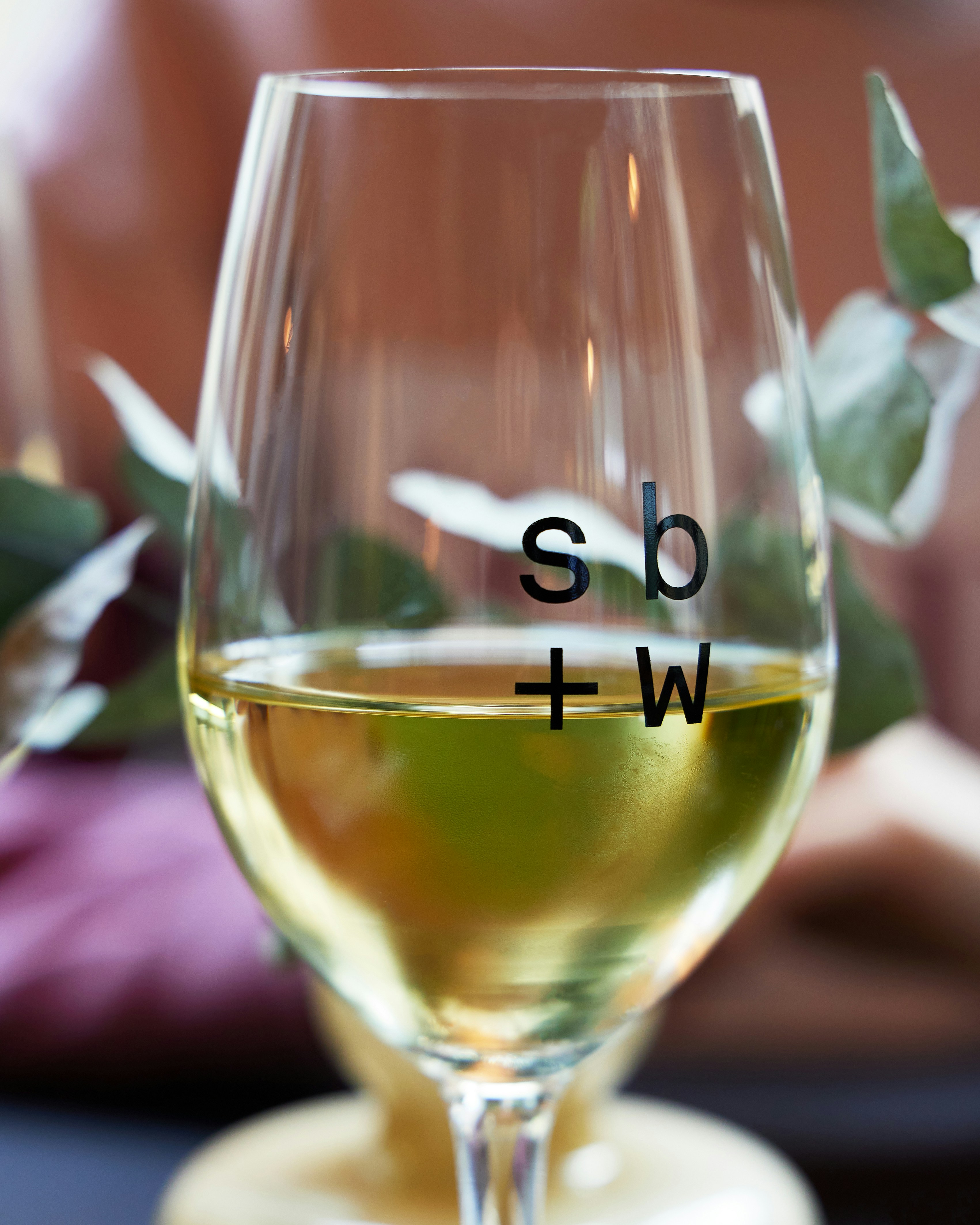 Glyphs Over Golden Wine: A Minimalist Glass Portrait