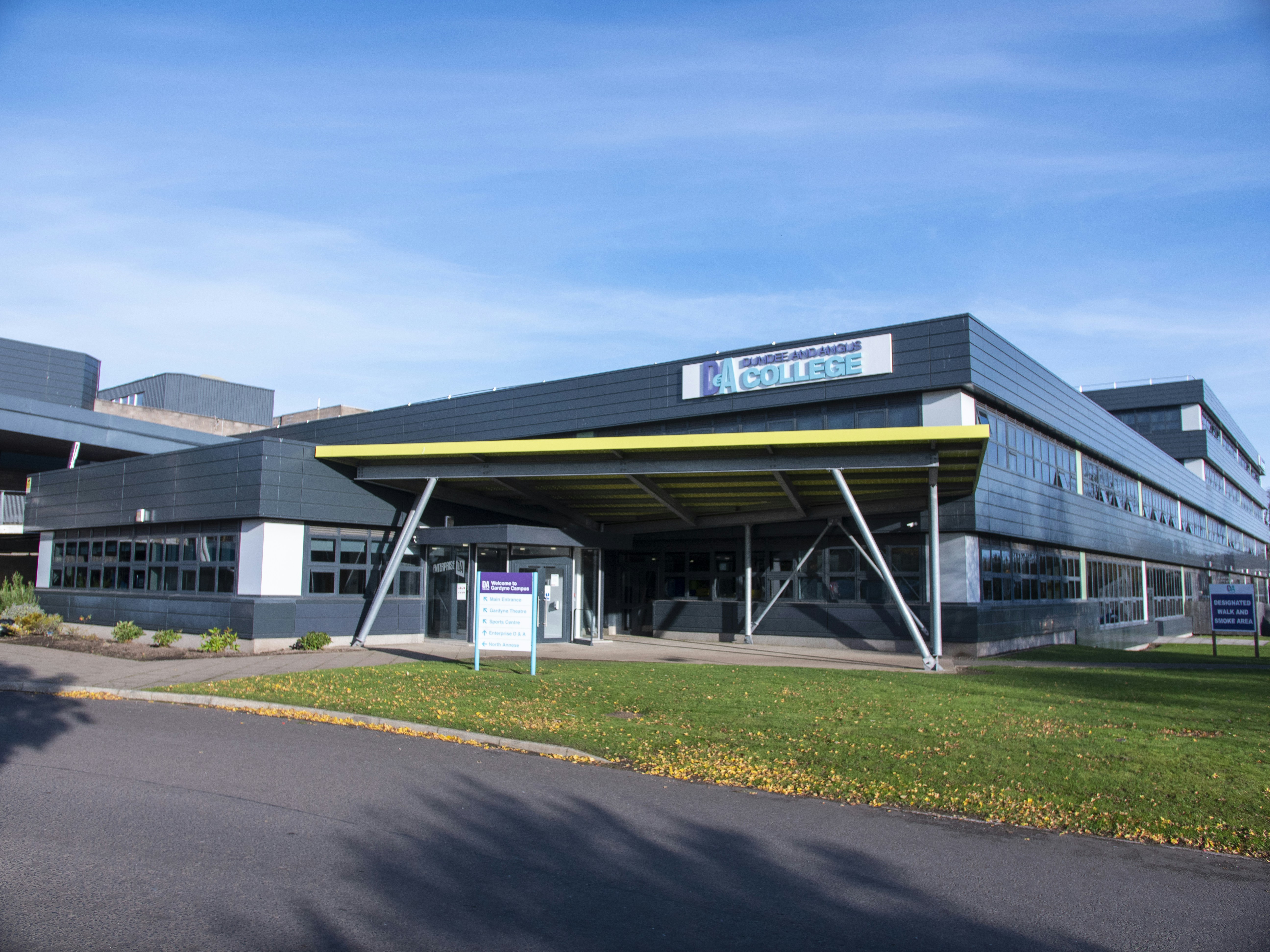 A building with a sign on the front photo – Free D&aicthelp Image on ...