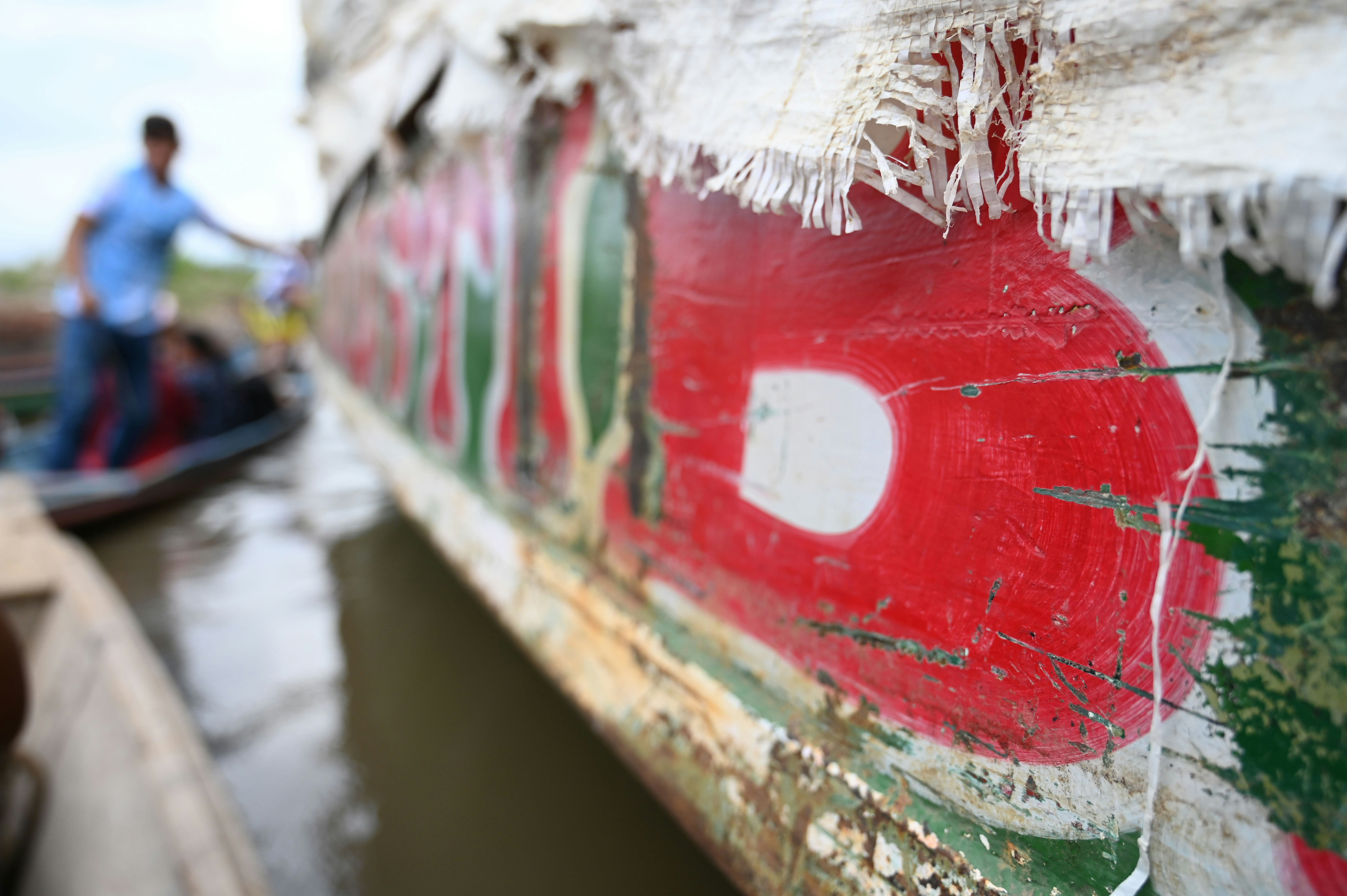 Close-up of Weathered Boat Artwork with Frayed Canopy