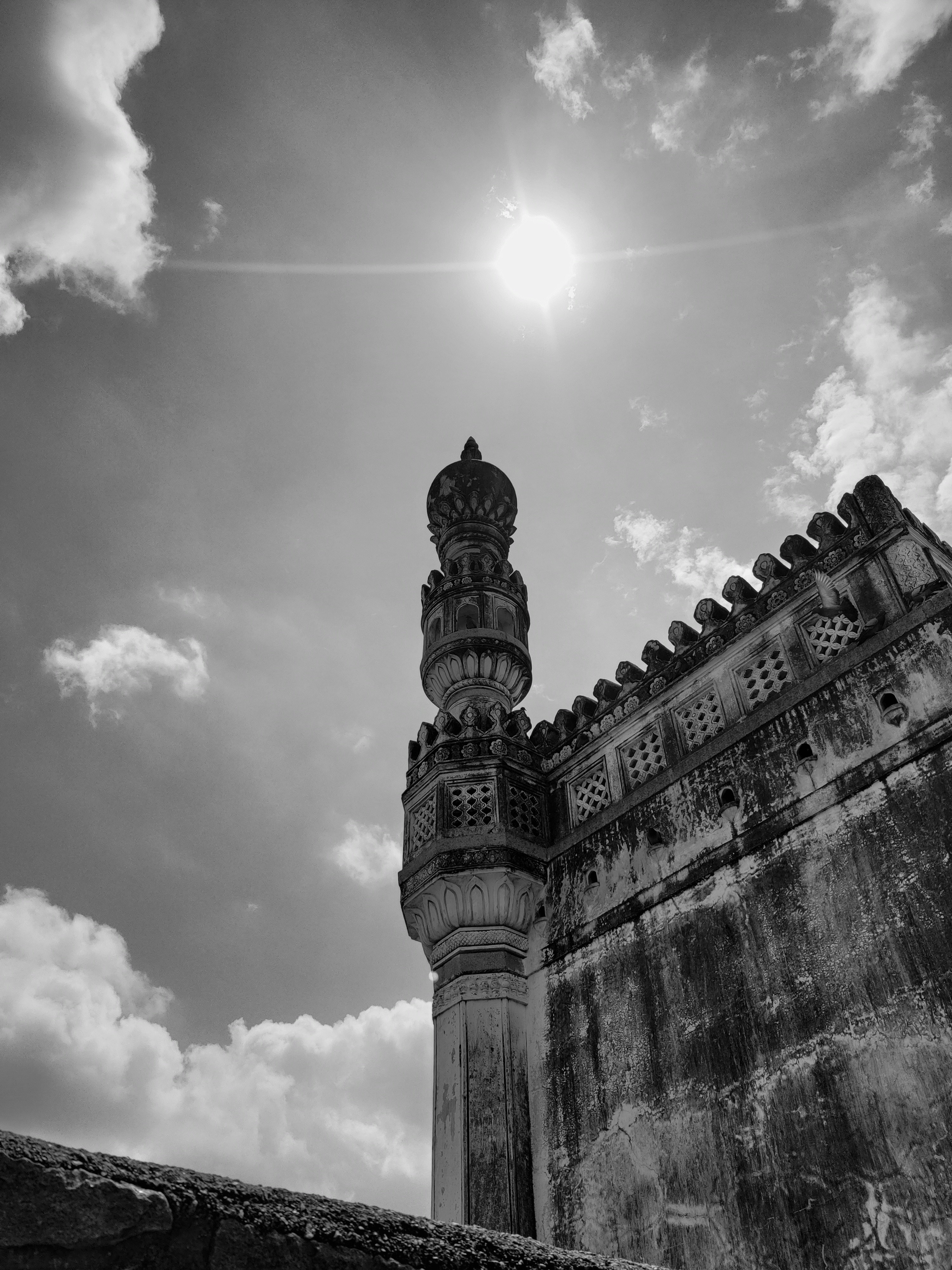 Sunlit Crown: A Minaret Clings to Time in Monochrome