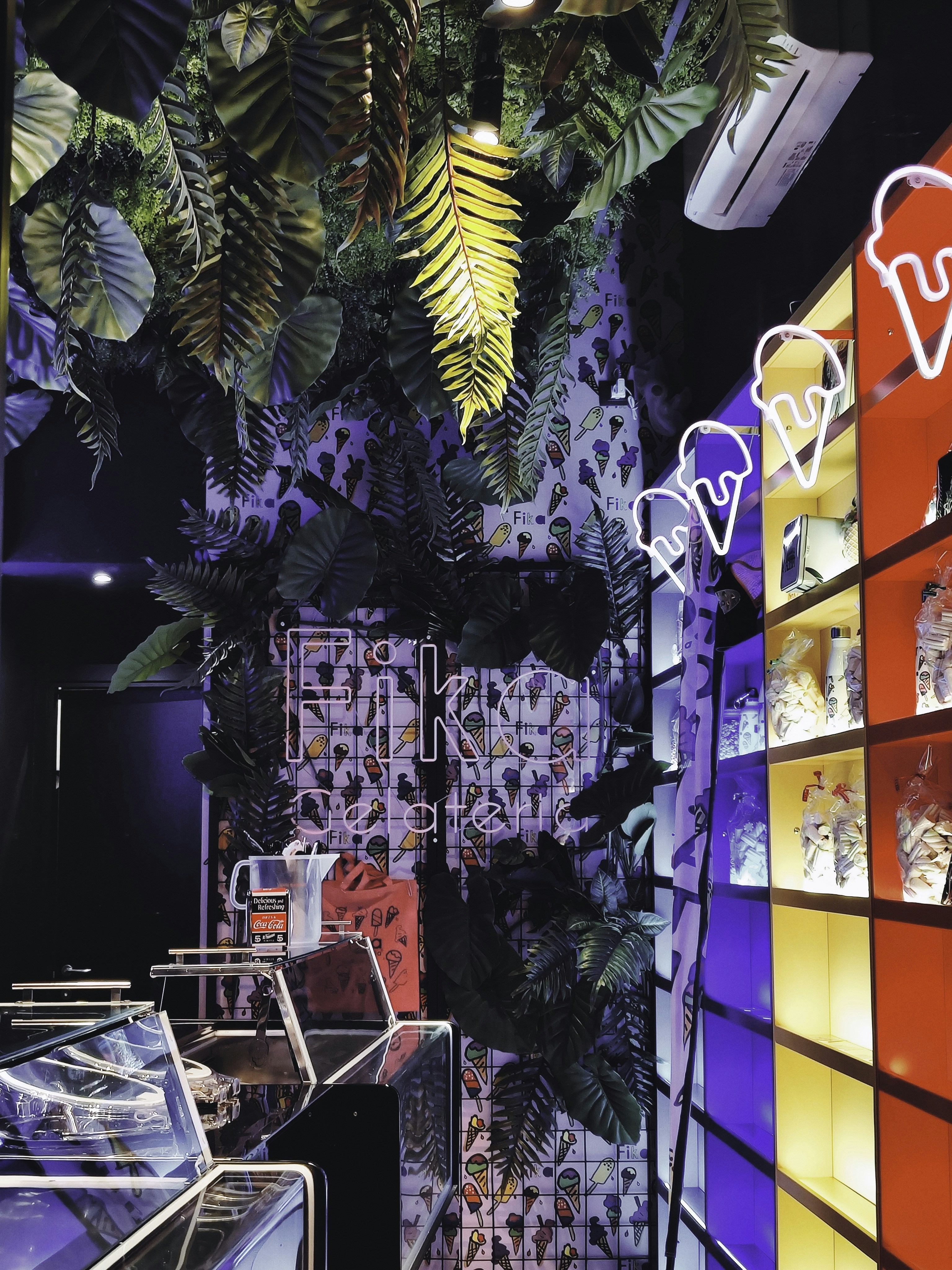 Neon Jungle Over Glass: Tropical Foliage Meets Rainbow Shelves