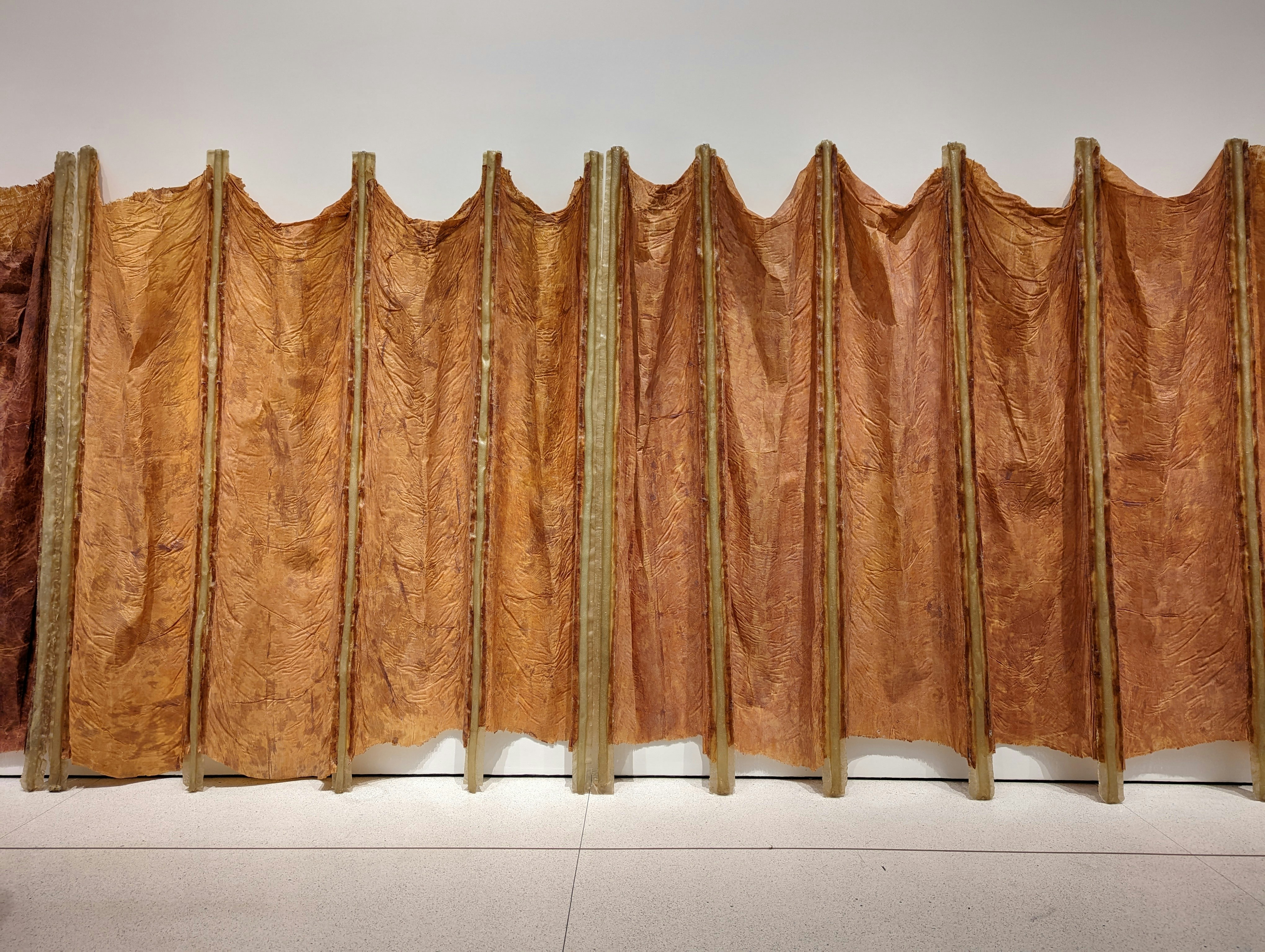 Ember Slats: A Rhythm of Textile Columns in a White Gallery