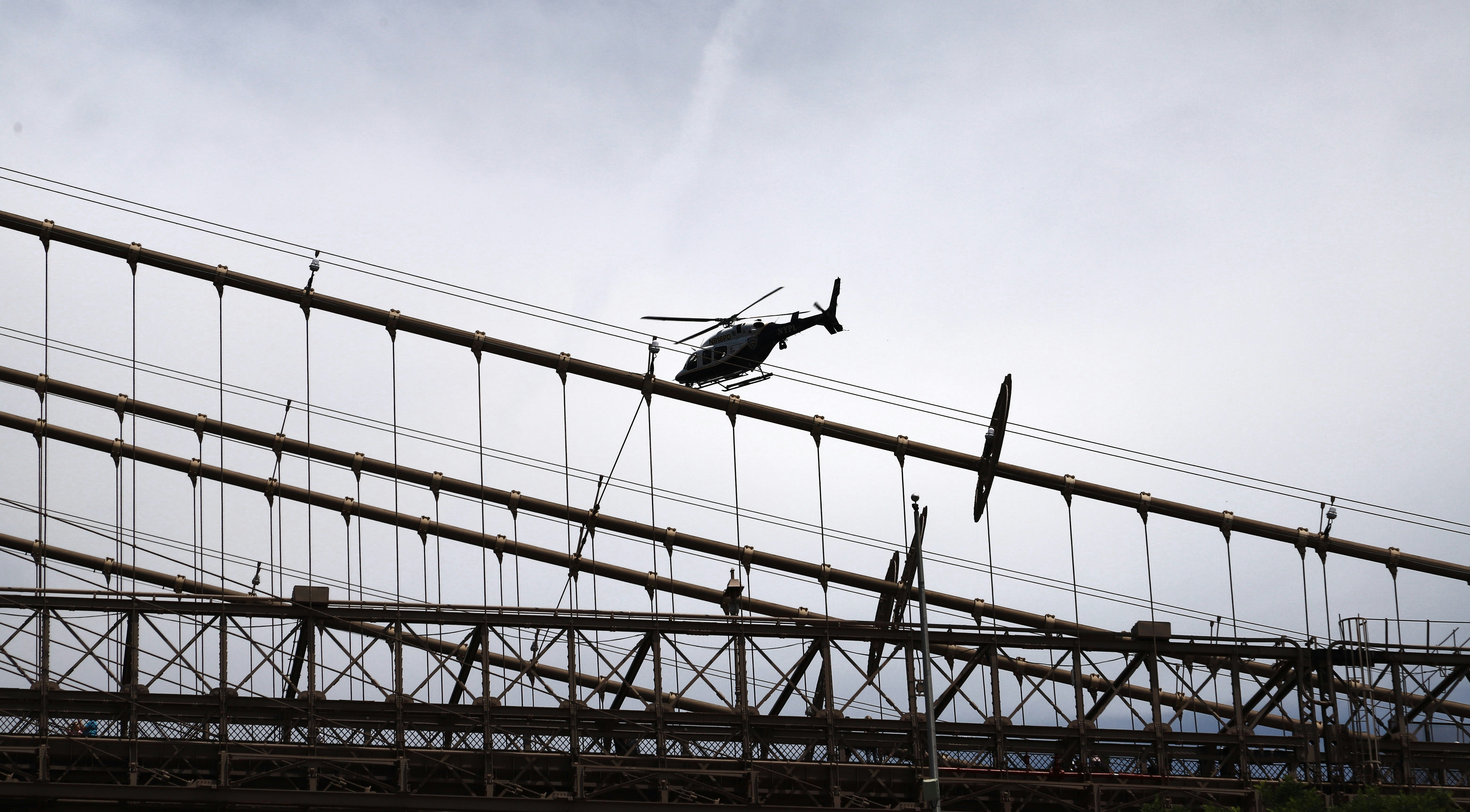 A helicopter flying over a power line photo – Free Fulton ferry ...